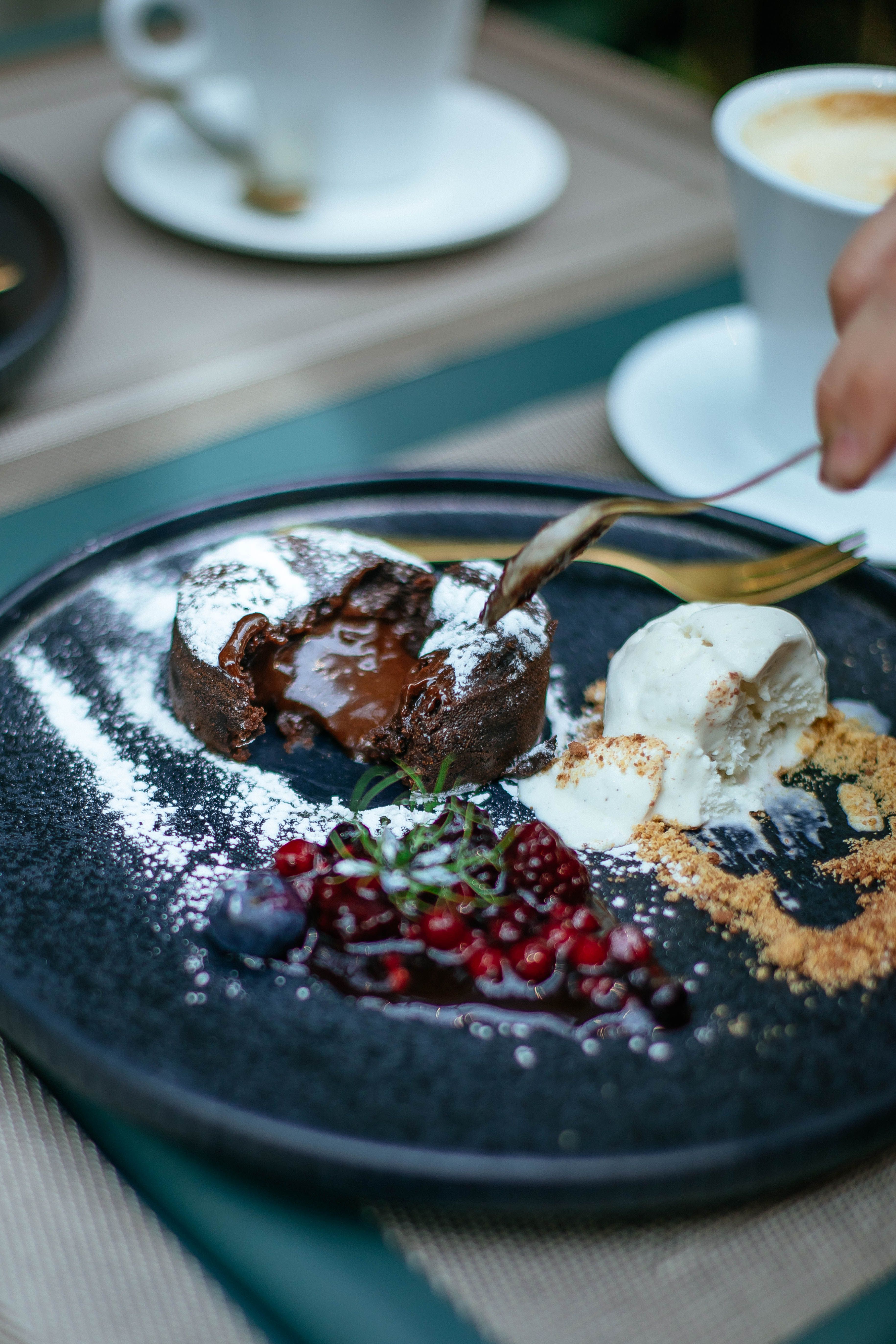 Food Presentation of Sweet Desserts on Plates and Lit Scented Candle ...
