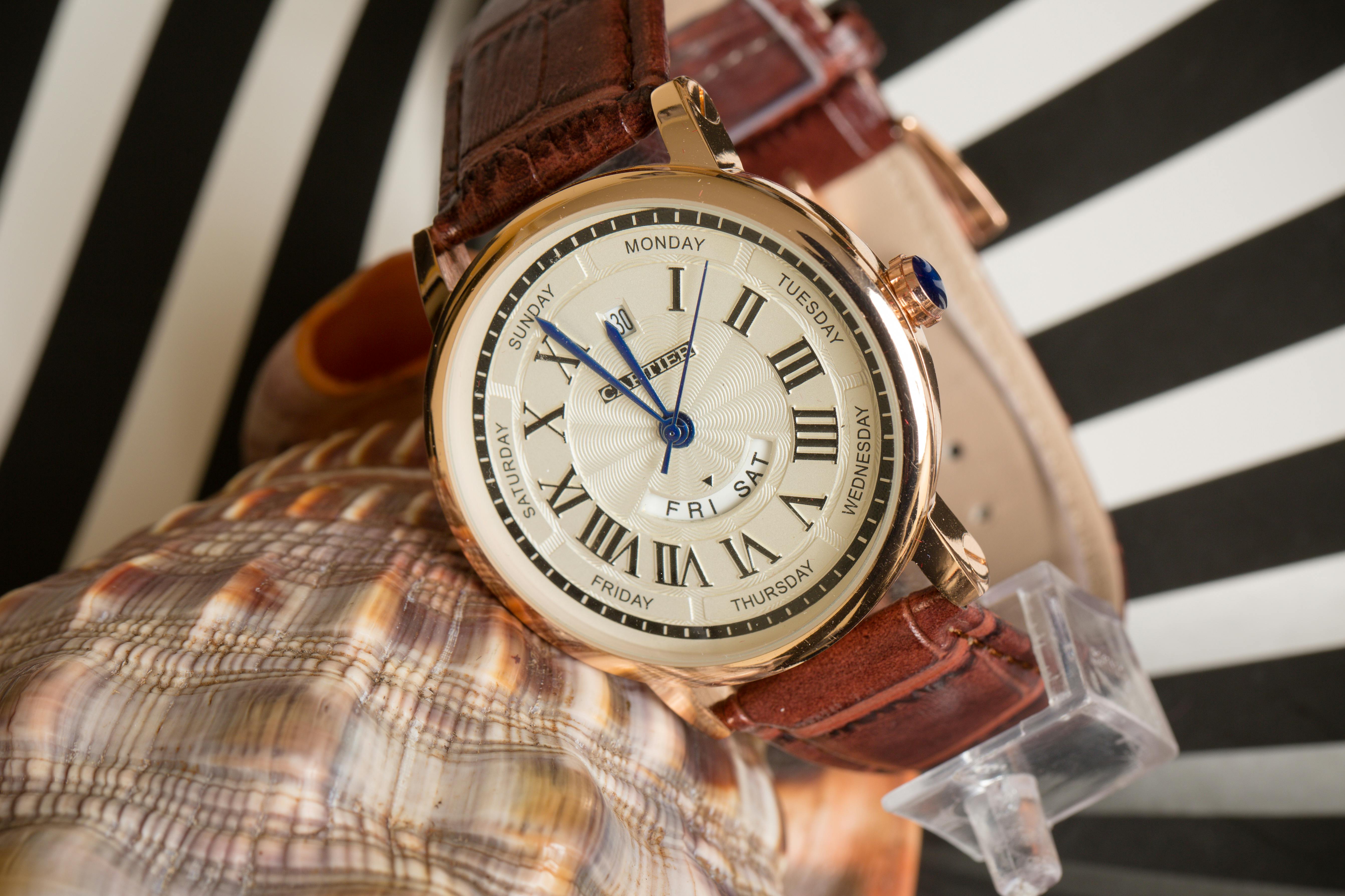 Photo of Two Analog Watches with Black Leather Bands on Gray Surface ...