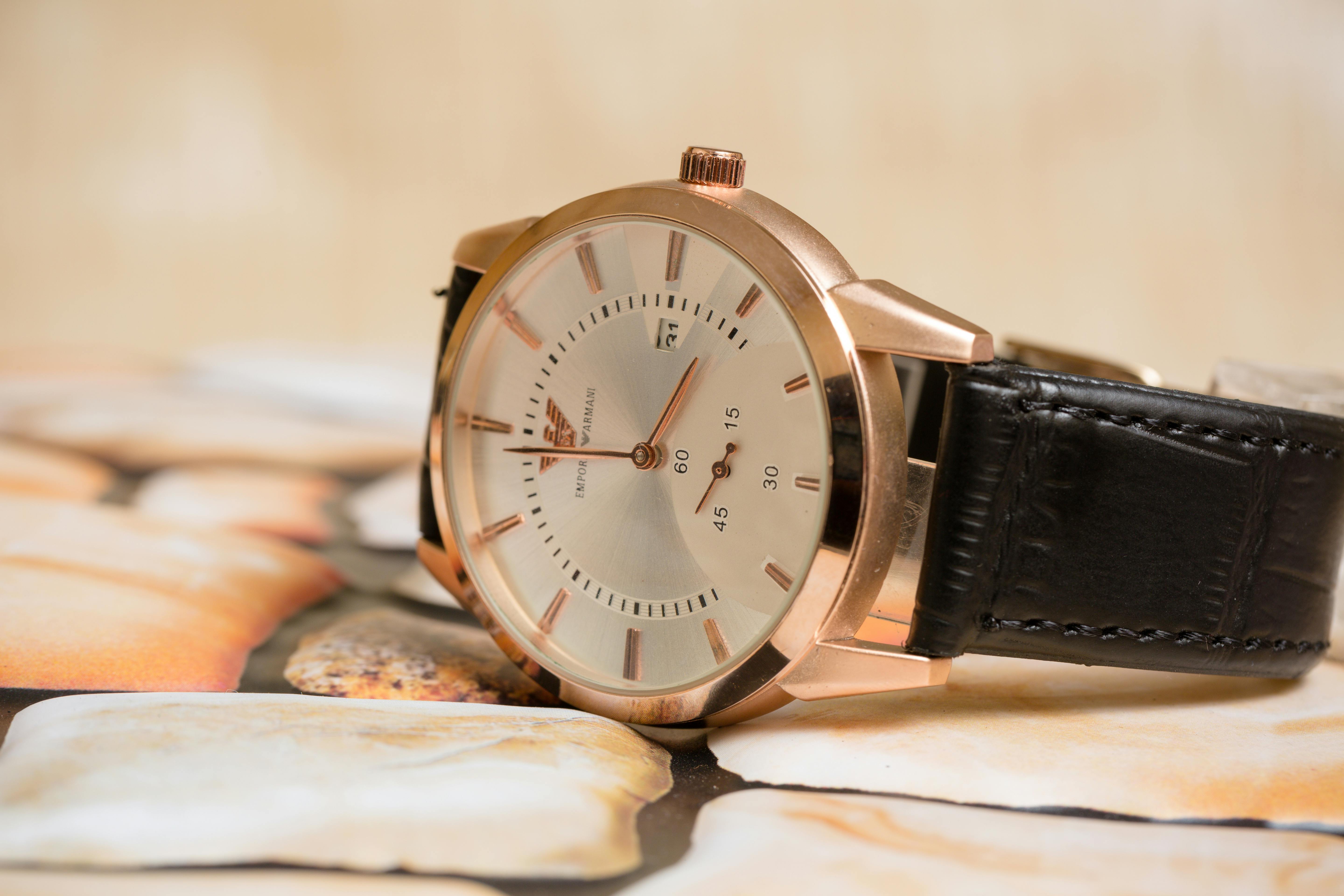 Photo of Two Analog Watches with Black Leather Bands on Gray Surface ...