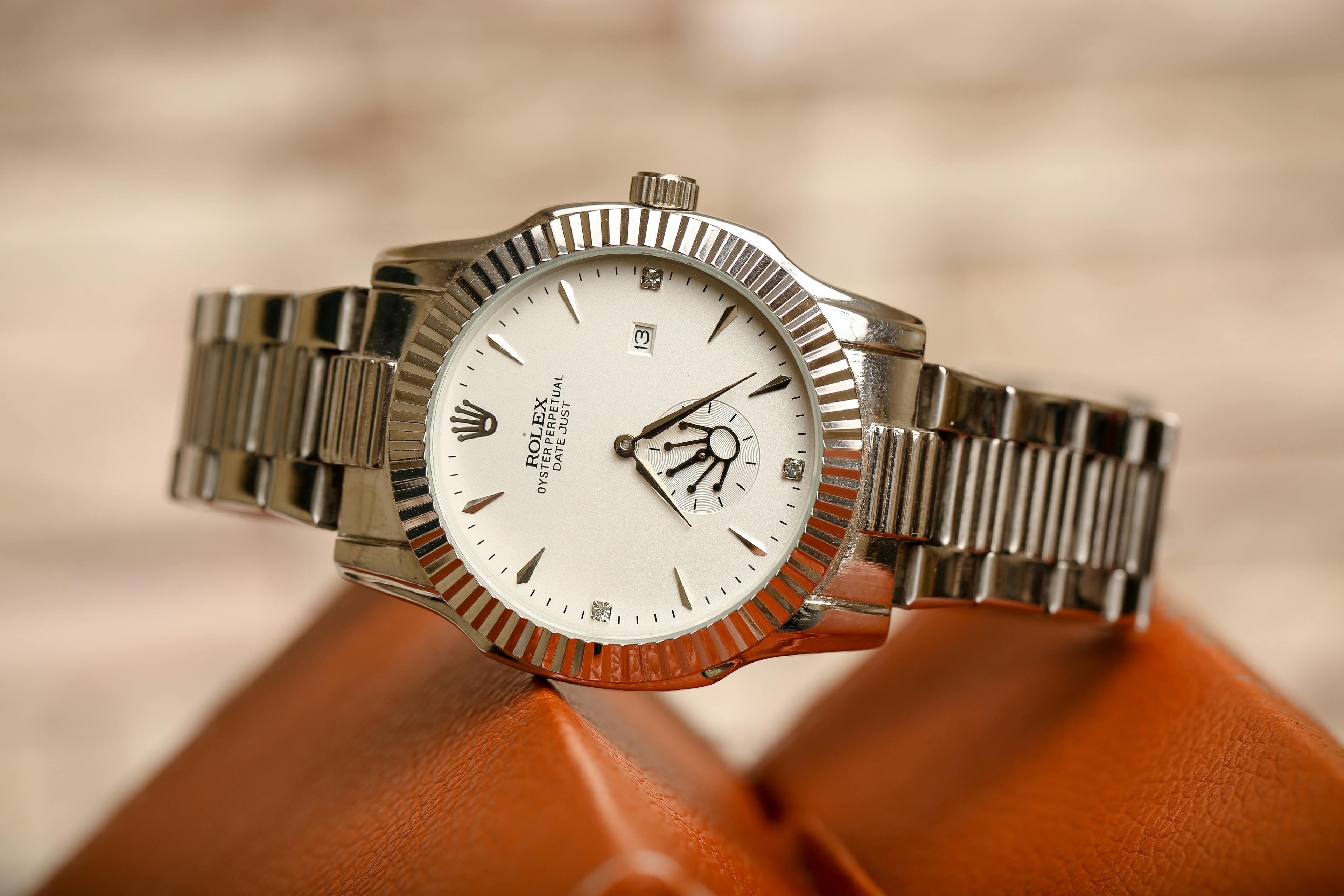 Photo of Two Analog Watches with Black Leather Bands on Gray Surface ...