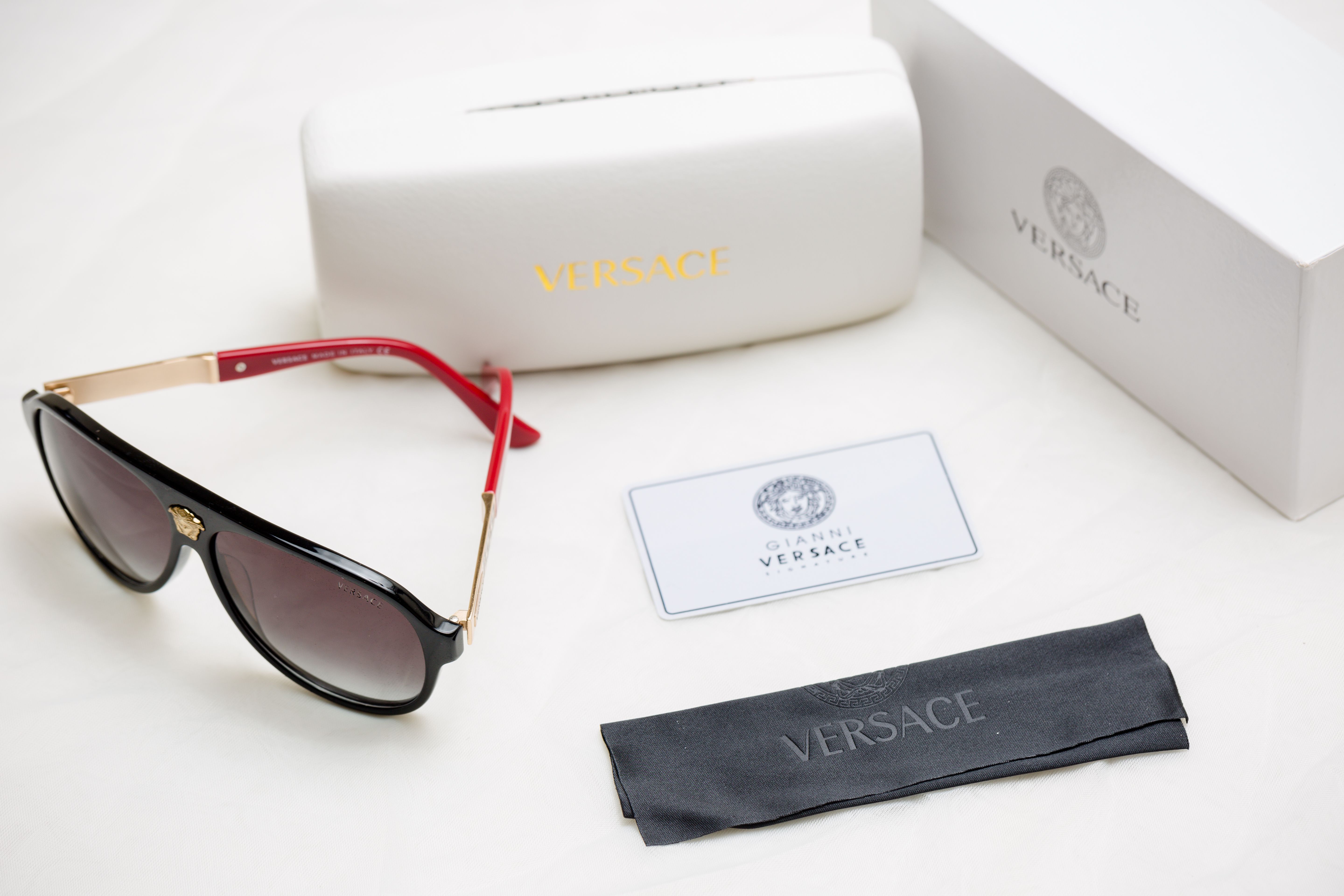 Luxury Sunglasses with Package on White Background · Free Stock Photo