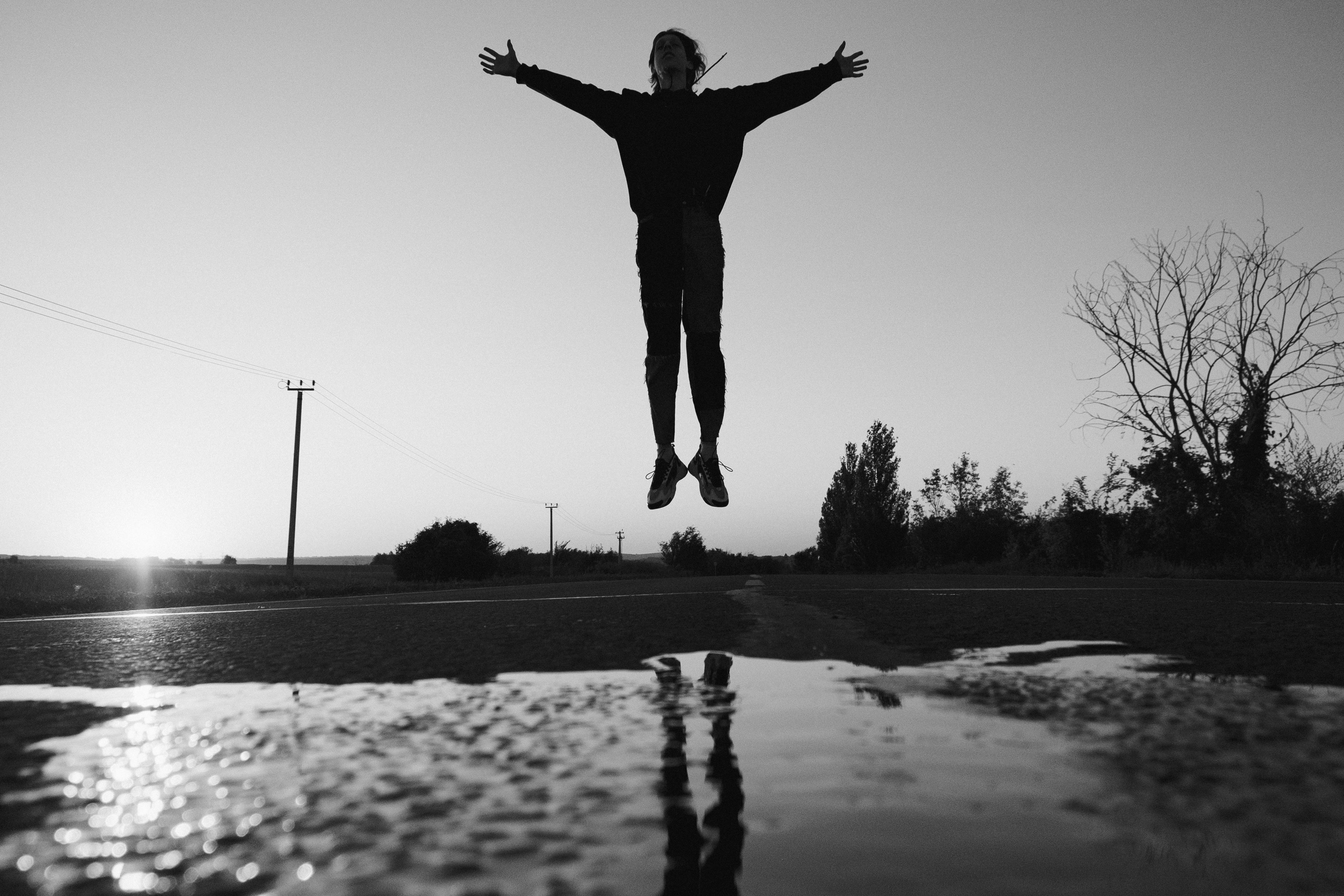 Reflection of a Person on a Puddle · Free Stock Photo