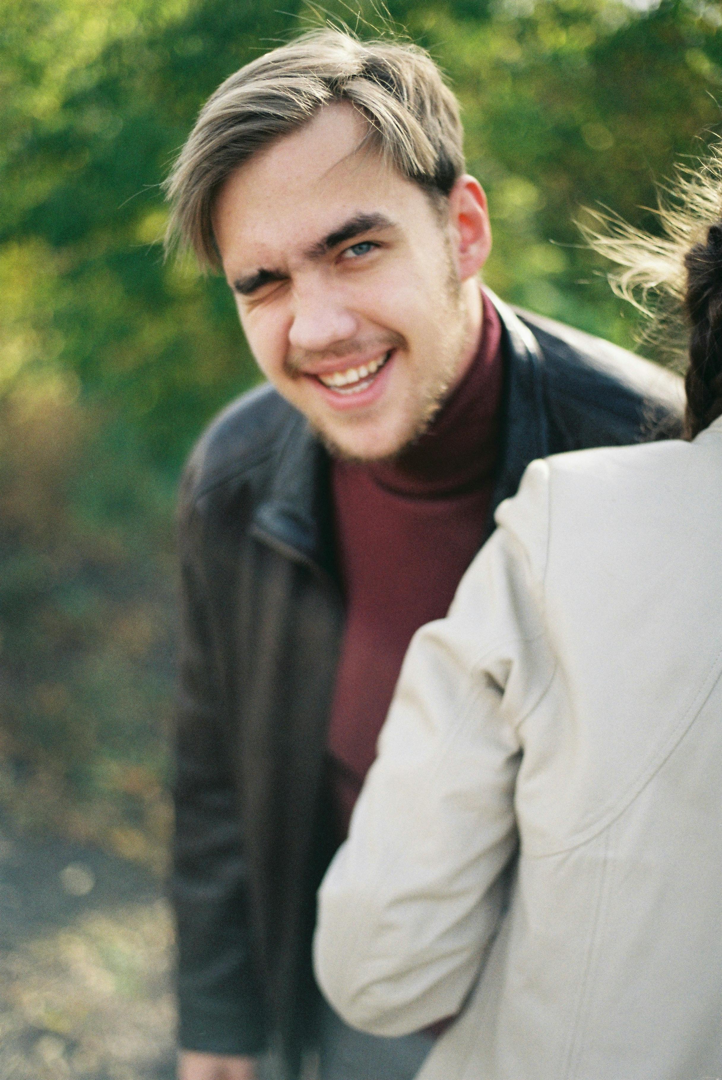Portrait of Young Man Winking · Free Stock Photo