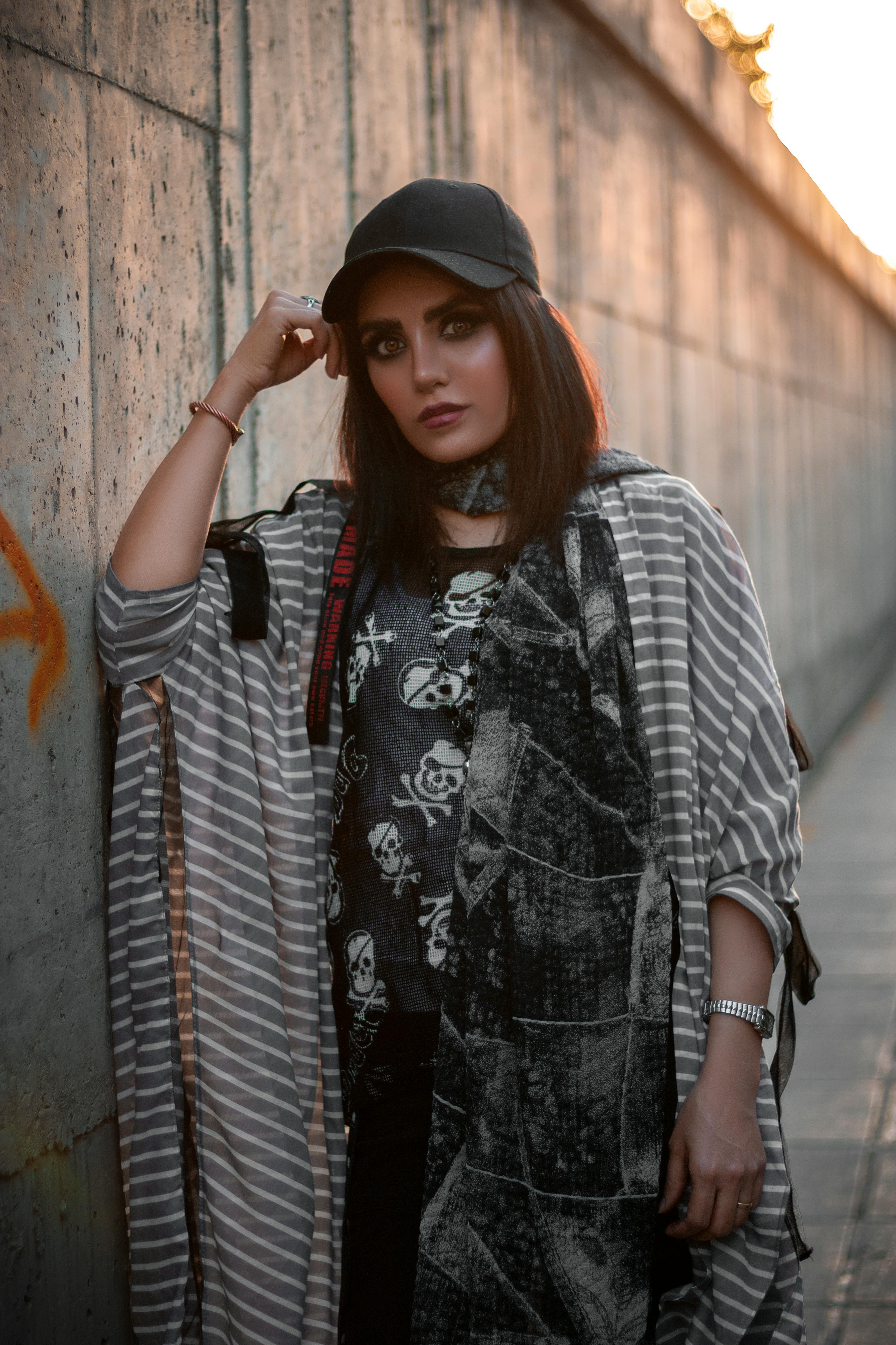 Photograph of a Woman with a Black Cap Posing · Free Stock Photo