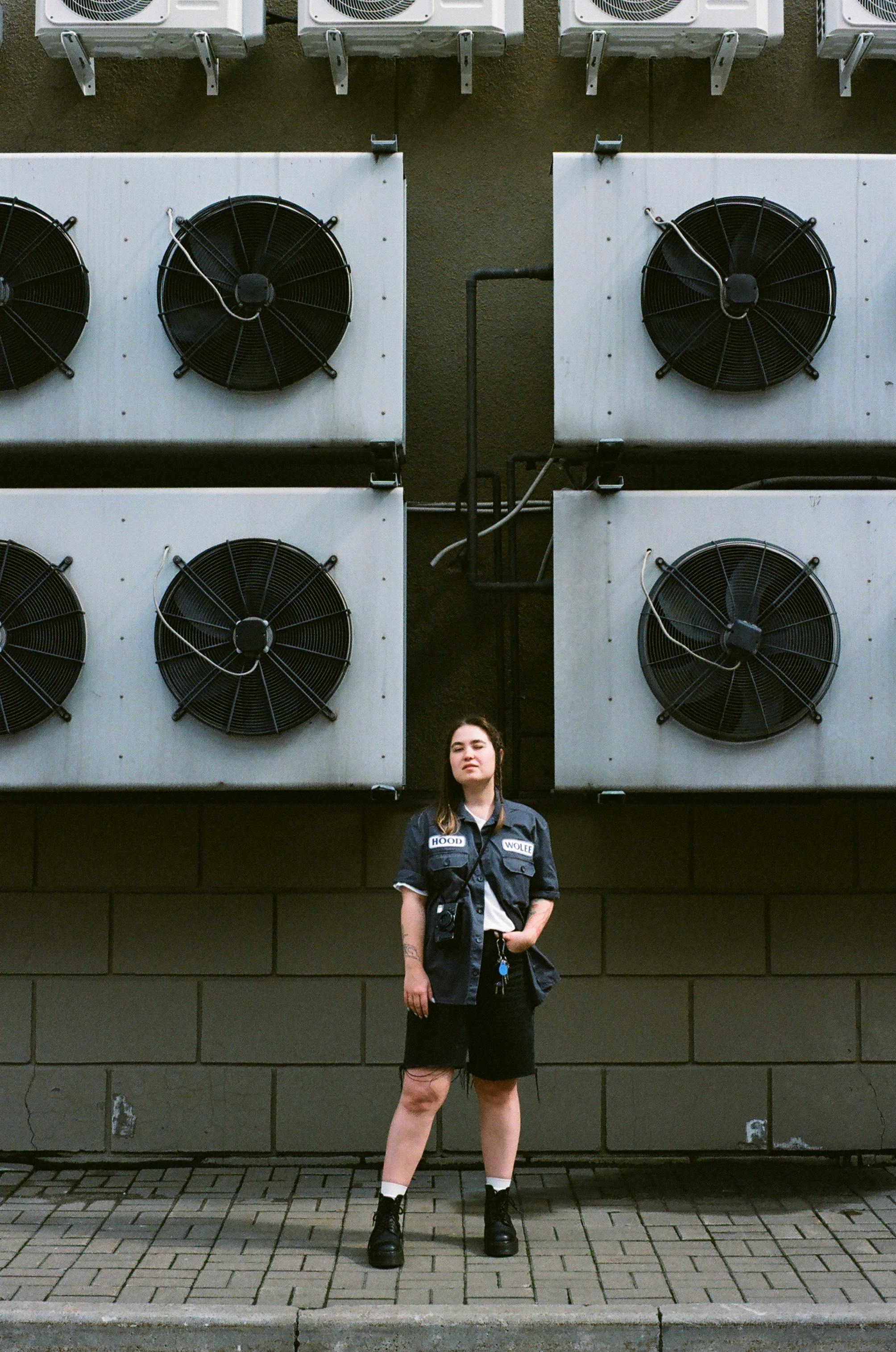 Woman Standing under Fans · Free Stock Photo