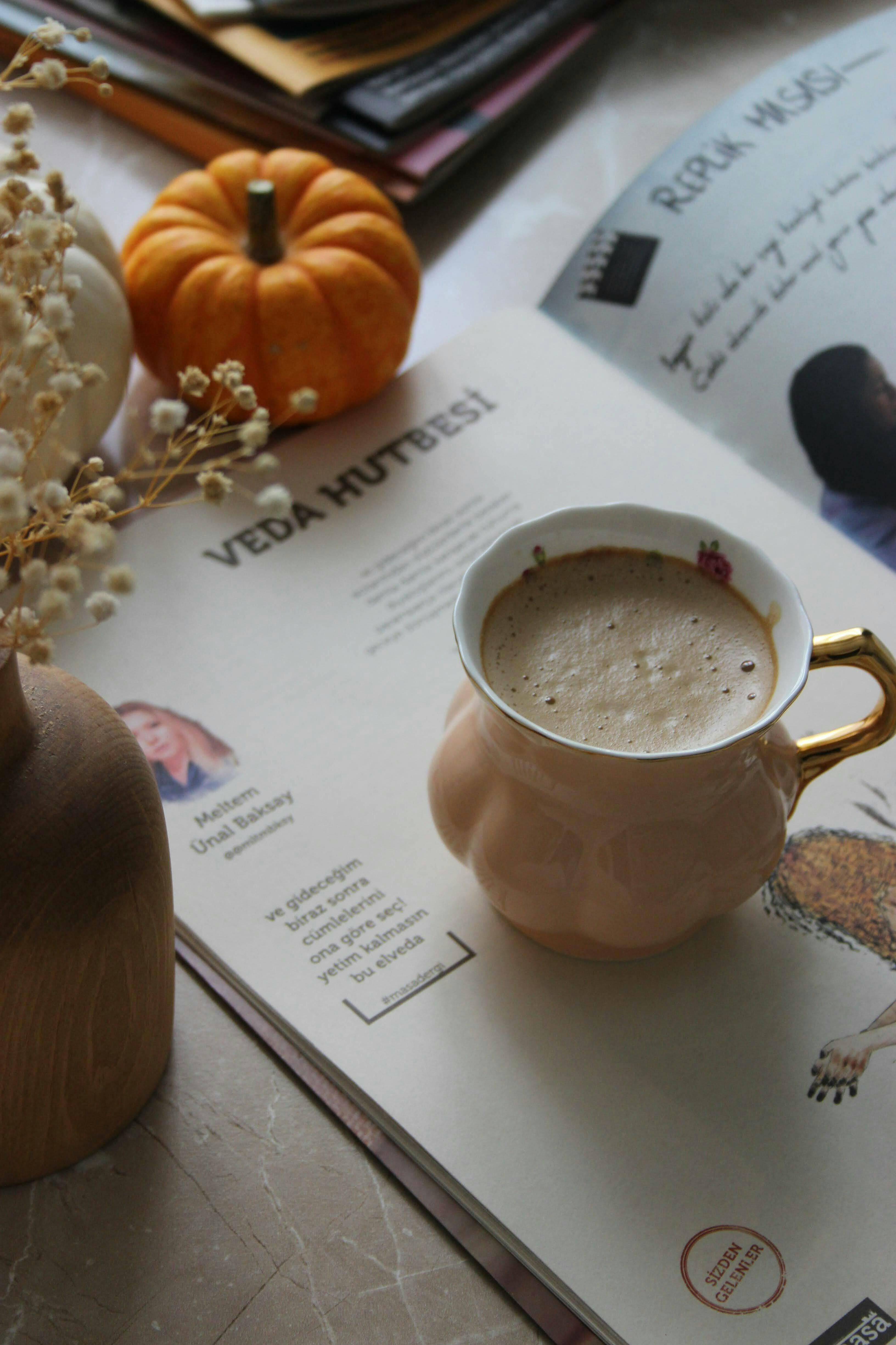 Close-Up Shot of Green Headphones Near a Magazine and Mug · Free Stock ...