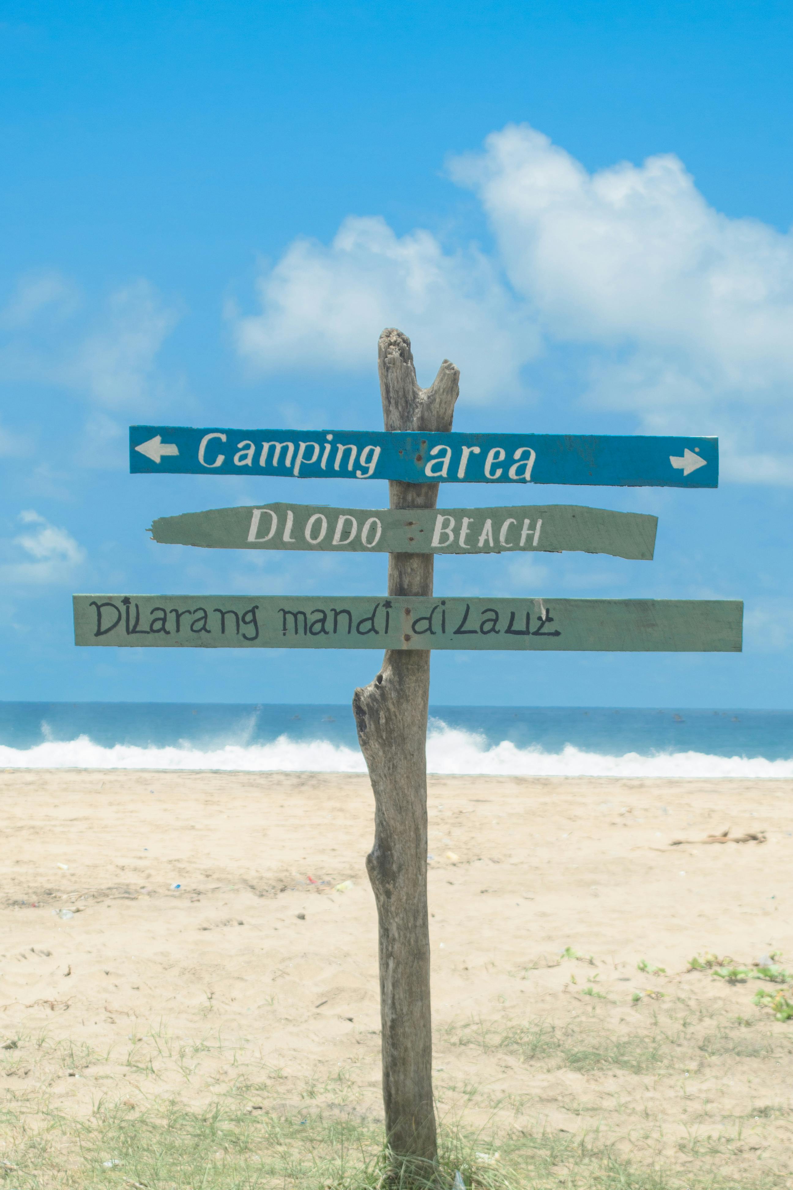 Brown Wooden Signage on the Beach · Free Stock Photo
