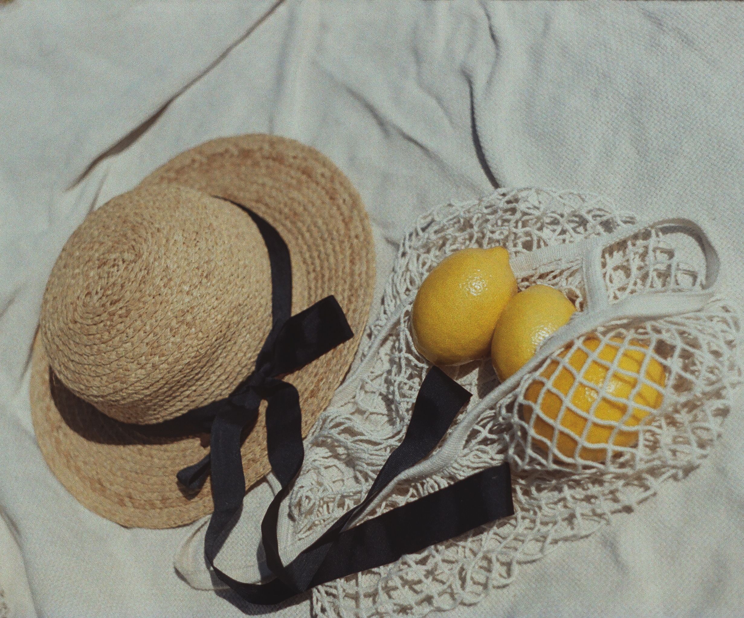 Overhead Shot of a Woven Hat on a Person's Lap · Free Stock Photo