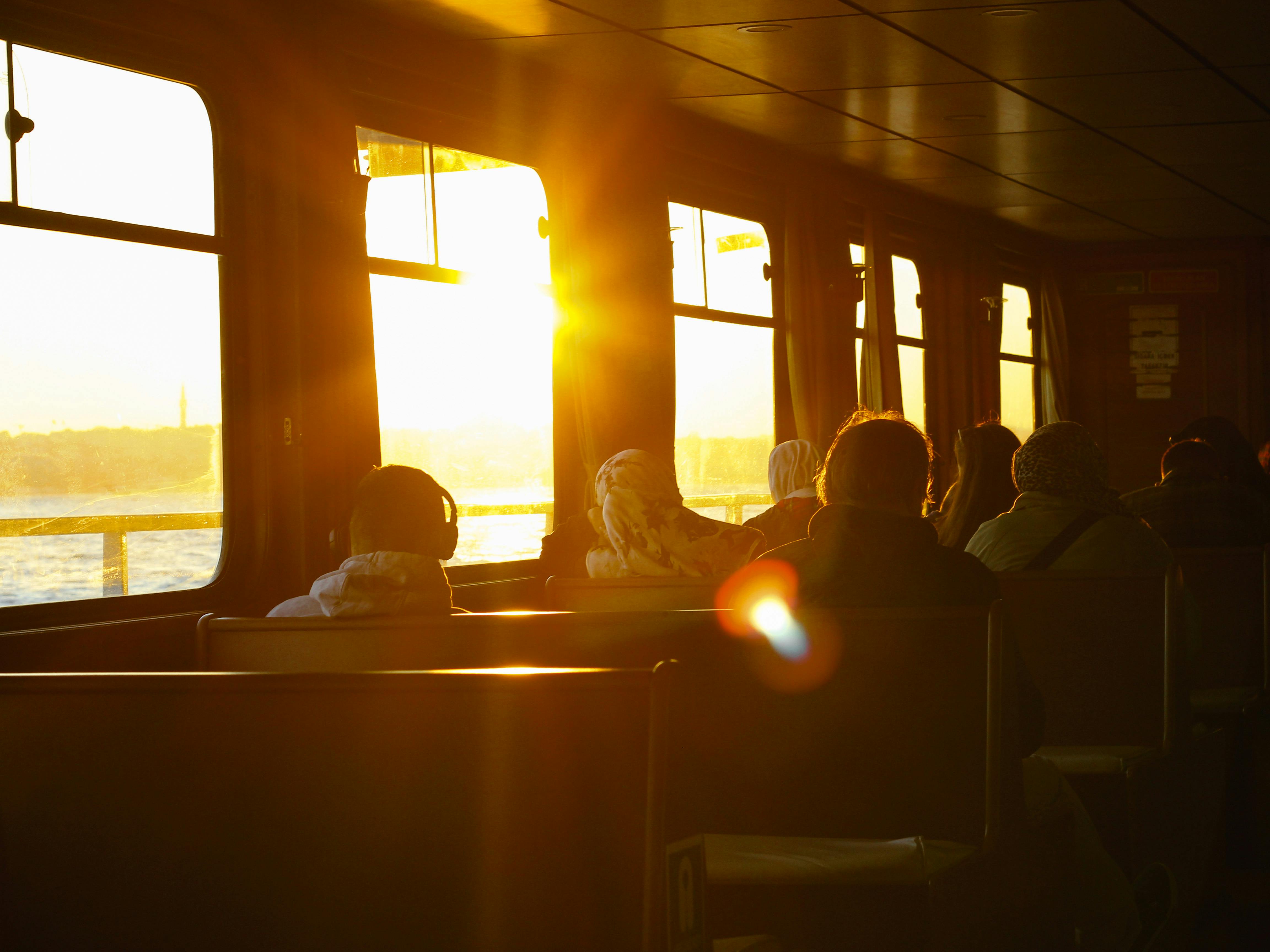 People Riding Train at Sunset · Free Stock Photo