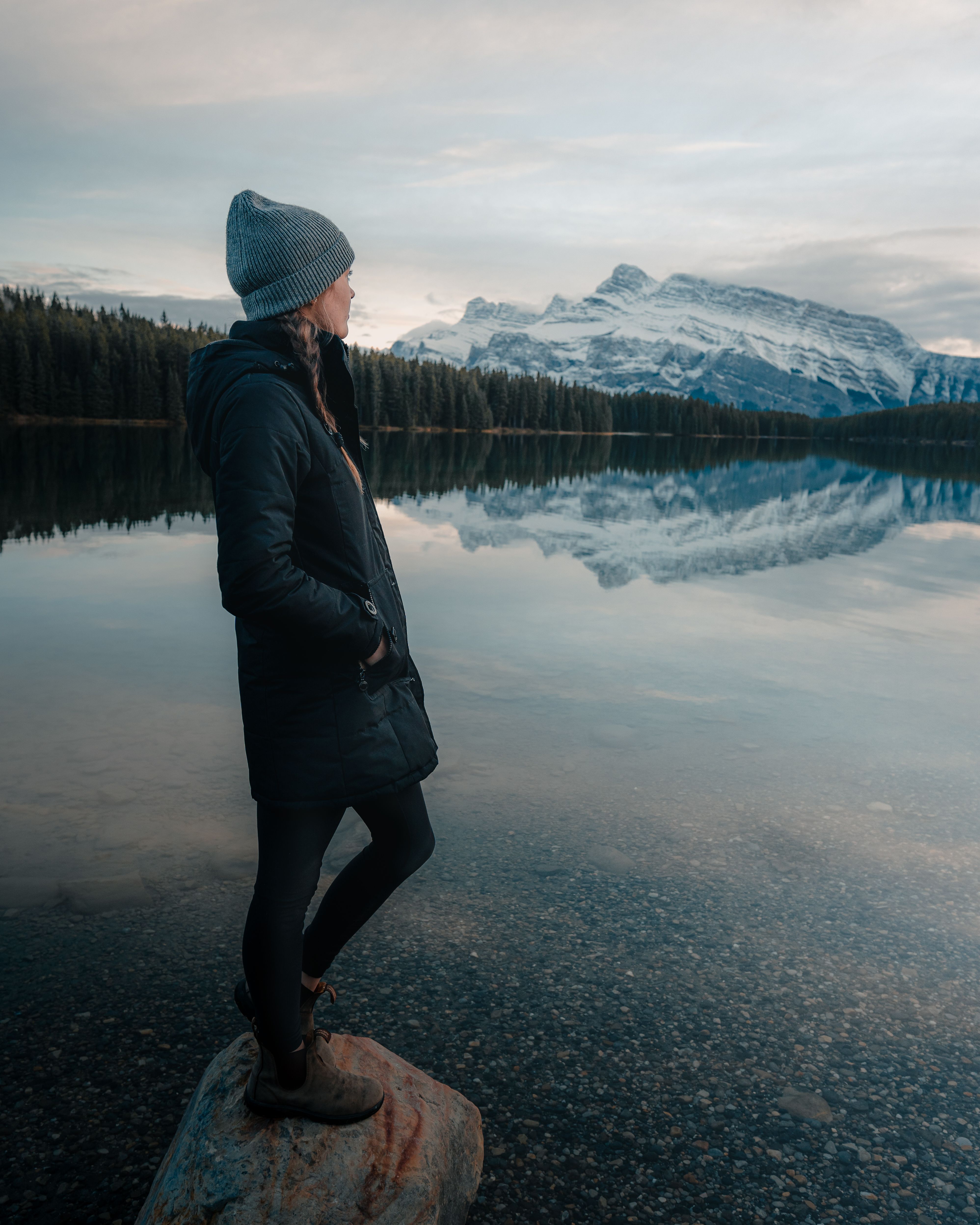 Woman Beside Lake in Mountains · Free Stock Photo