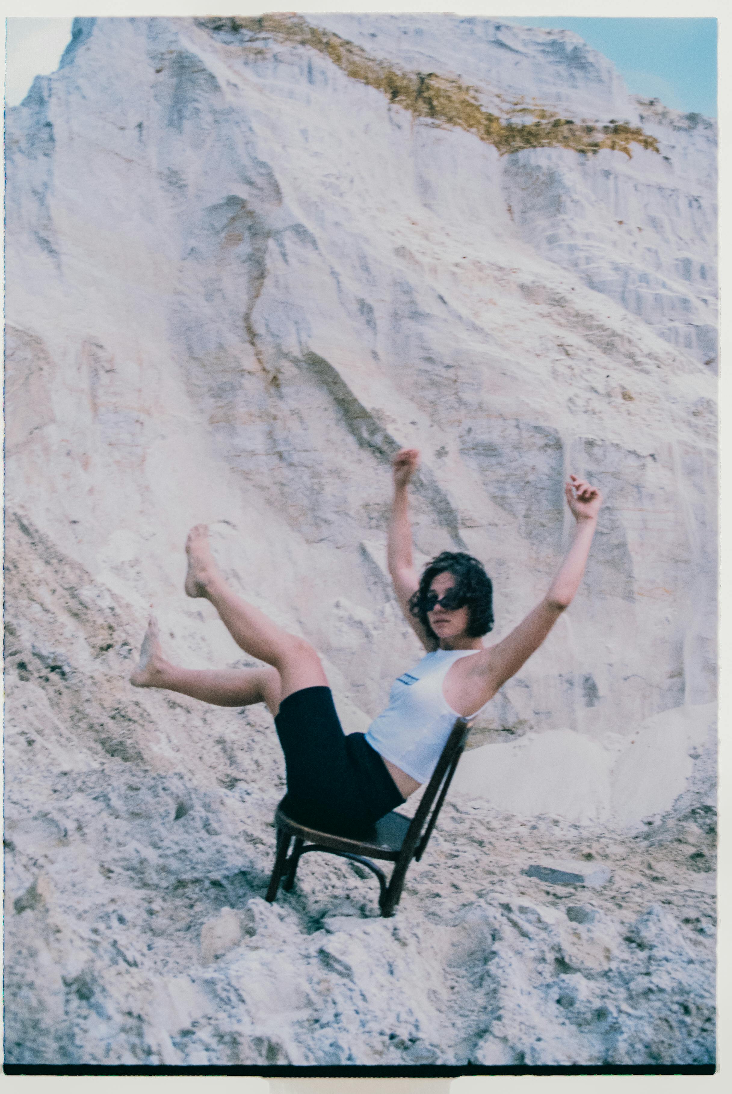 Woman Posing on Stones by Stream · Free Stock Photo