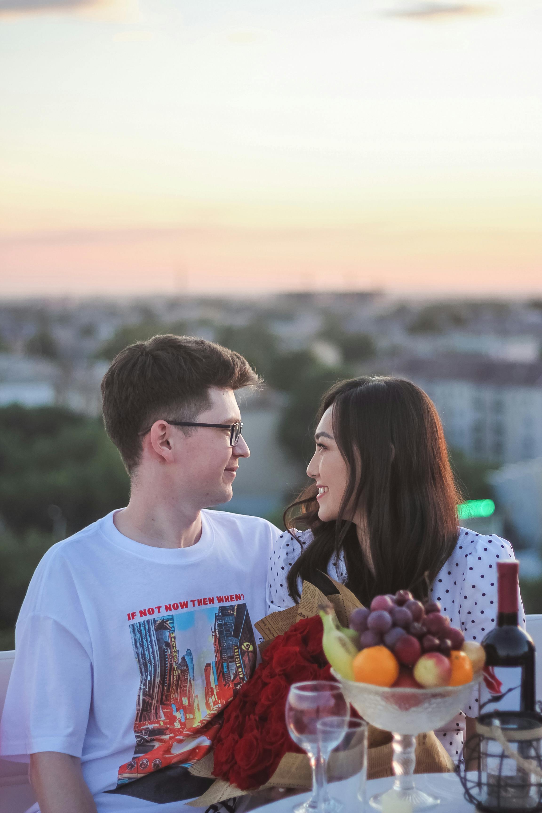 A Woman Sitting on the Lap of a Man · Free Stock Photo