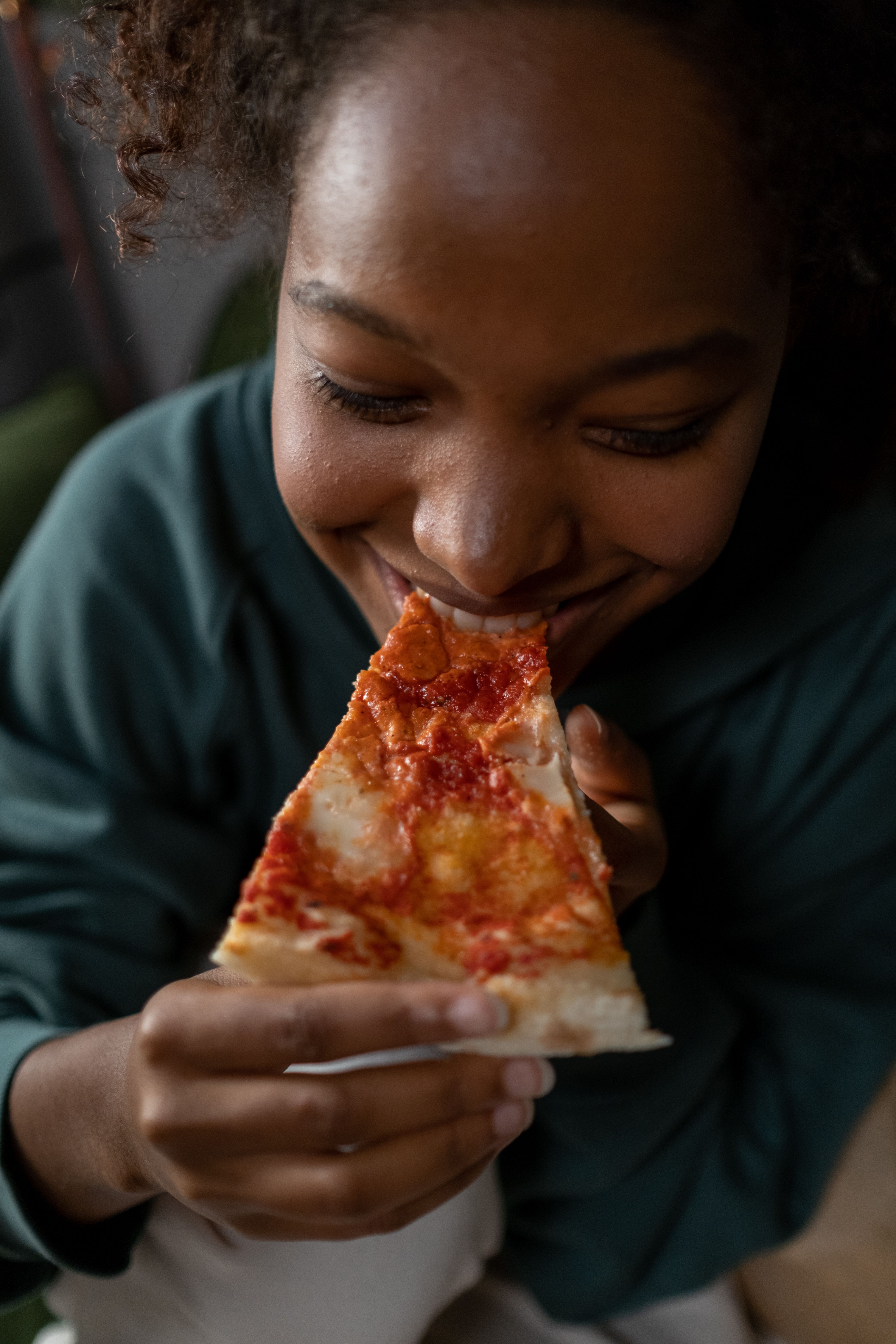 Young Woman Eating Pizza · Free Stock Photo
