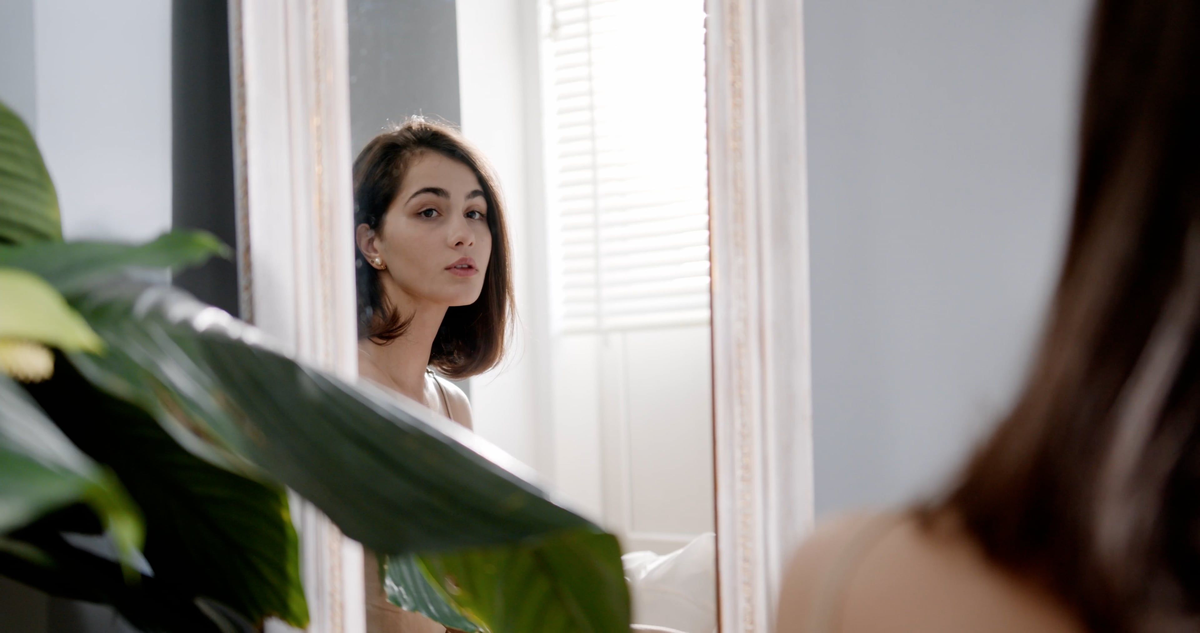 Woman Looking in Mirror · Free Stock Video