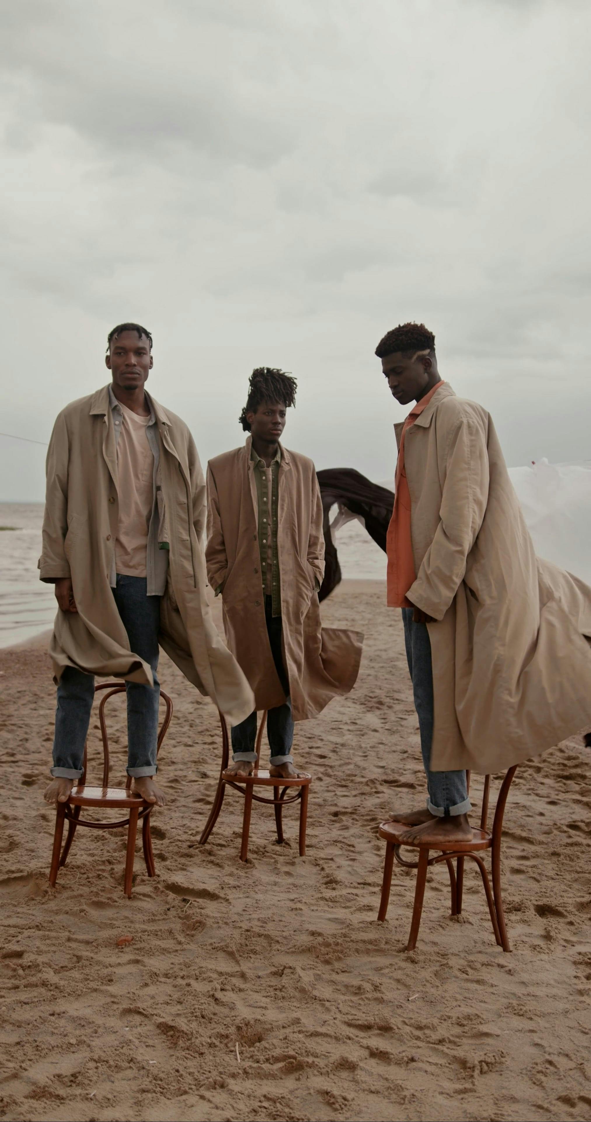 Young Men in Trench Coats Posing on the Beach Free Stock Video Footage ...