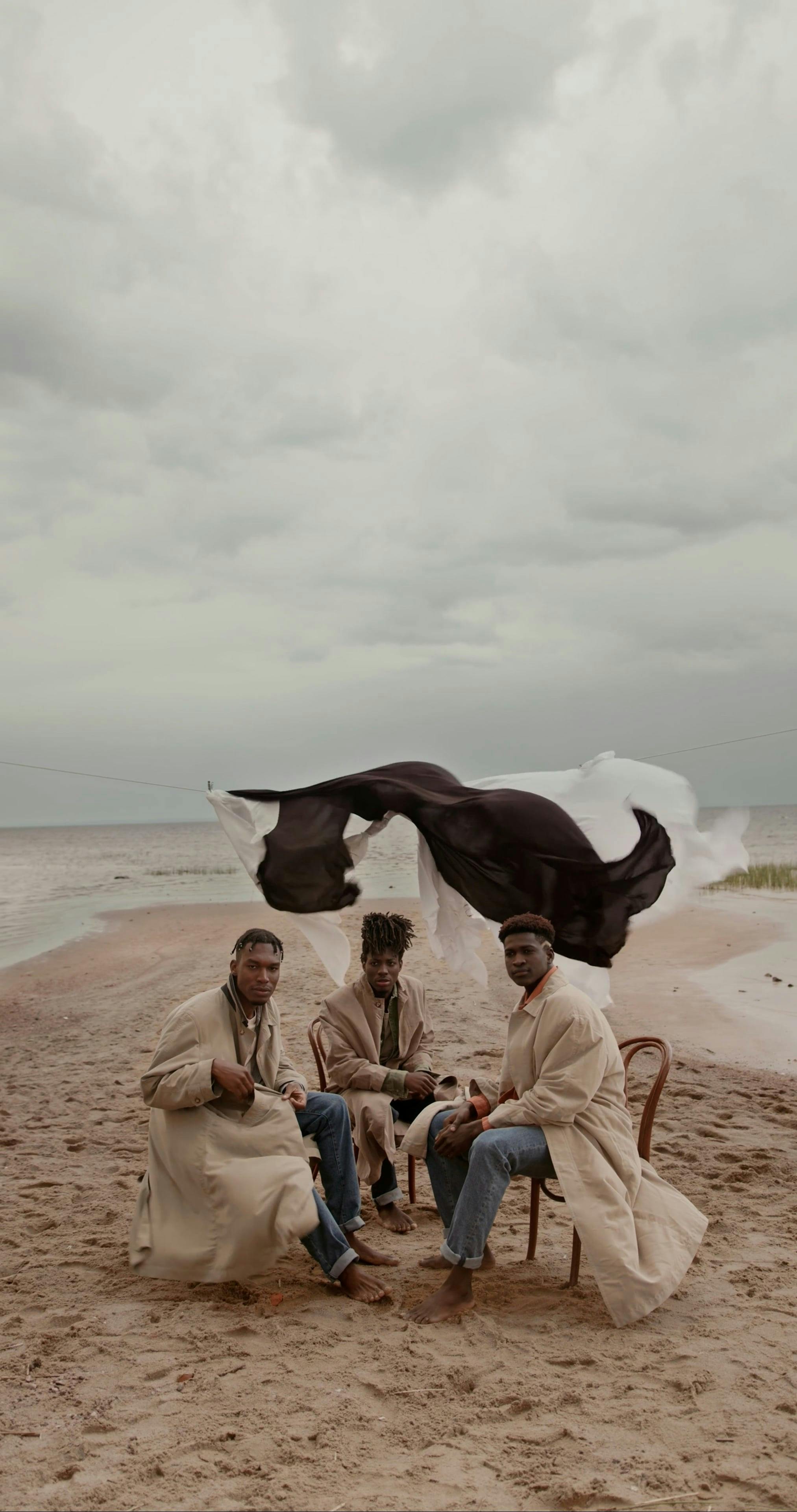 Young Men in Trench Coats Posing on the Beach Free Stock Video Footage ...