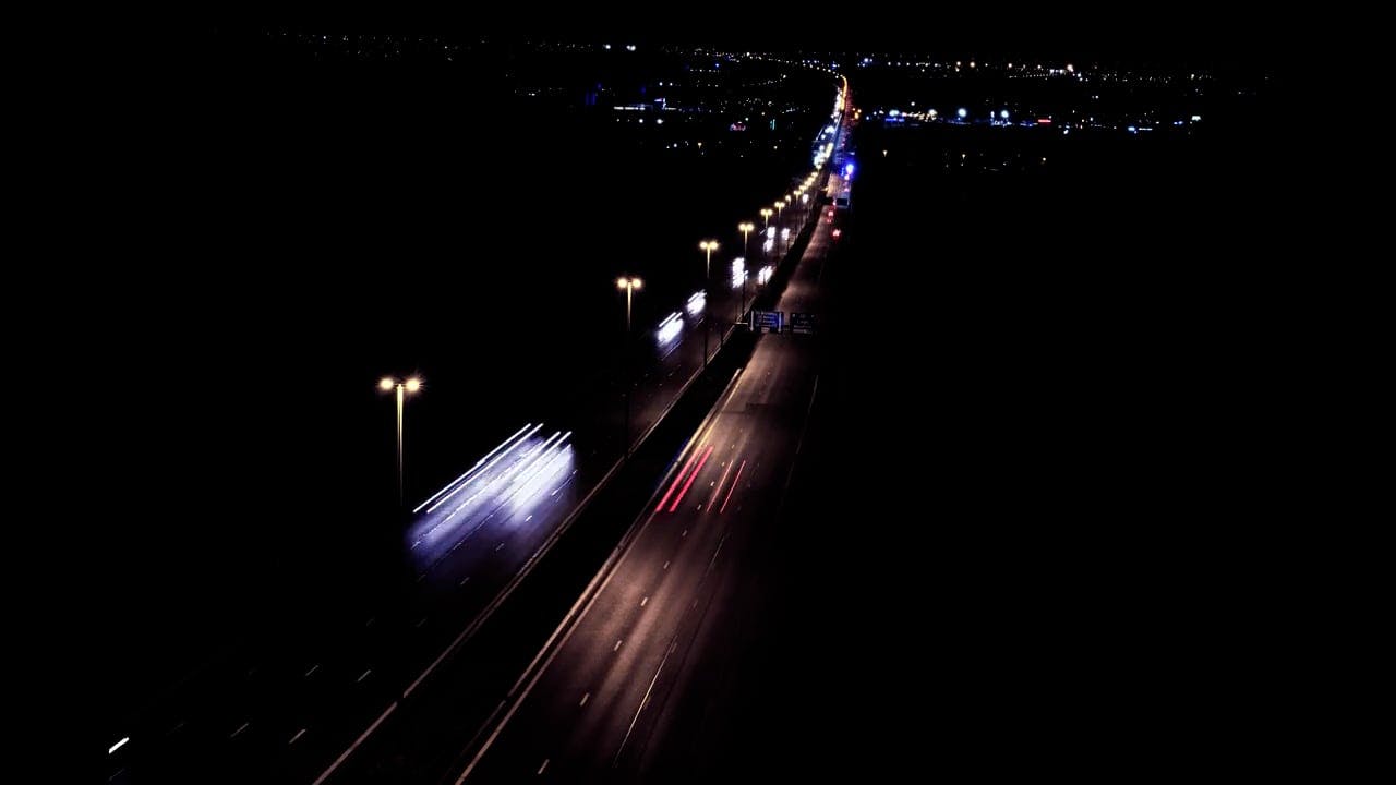 A Man Walking By The Roadside In The City At Nighttime Free Stock Video ...