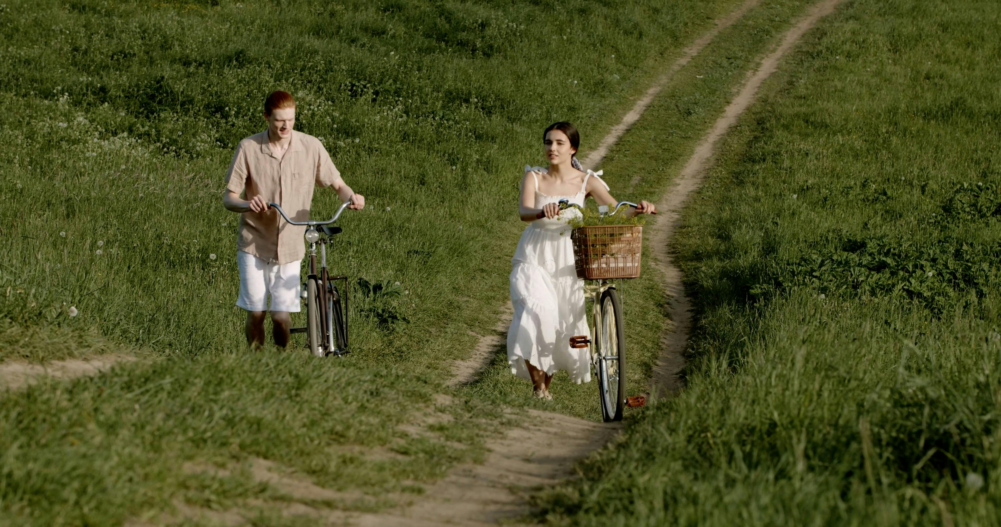 A Woman Looking at the Man Riding a Bike Free Stock Video Footage ...
