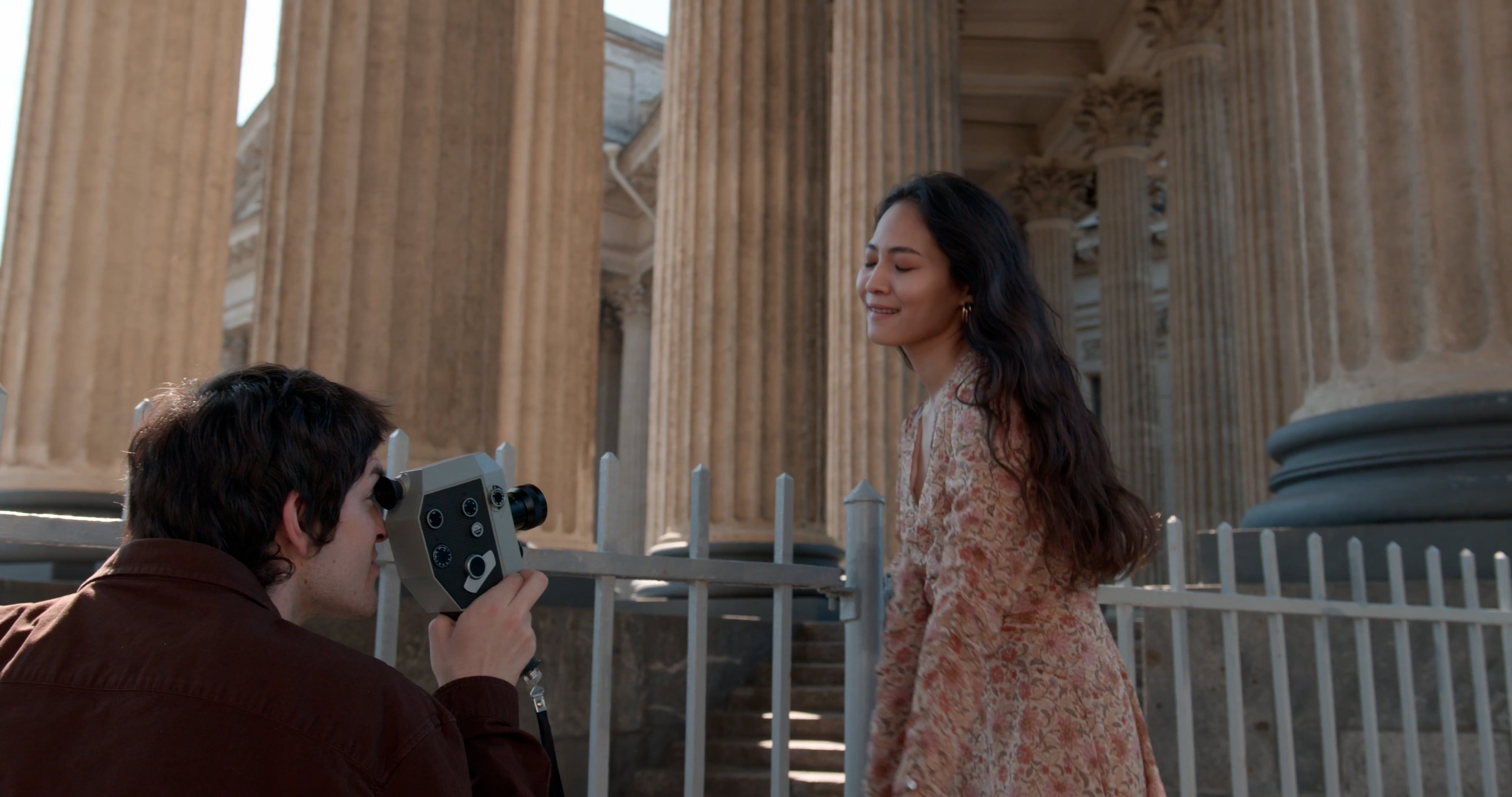 A Man Filming a Woman Using an Analog Camera · Free Stock Video