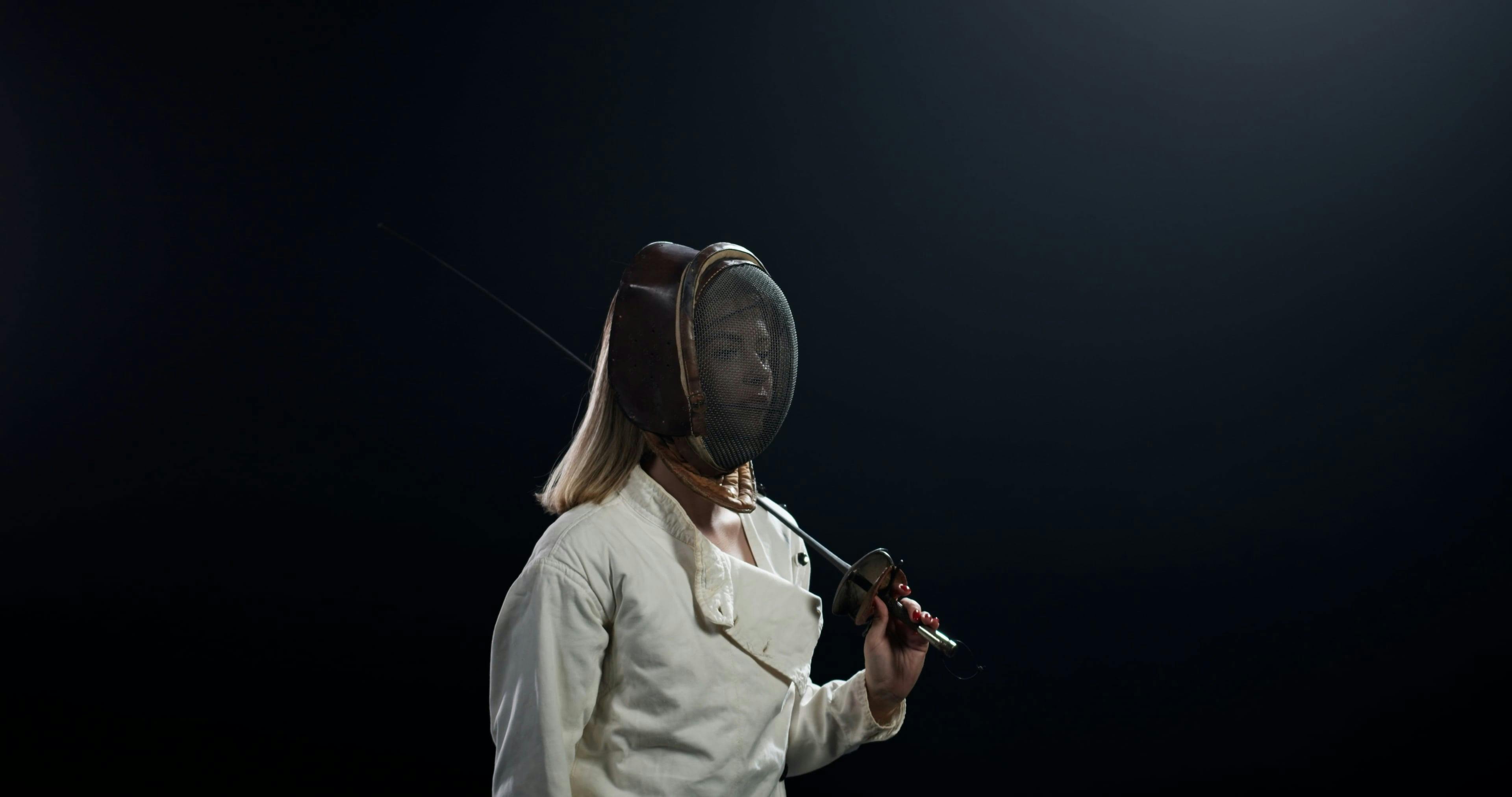 Woman in Fencing Uniform Taking off the Fencing Mask Free Stock Video ...