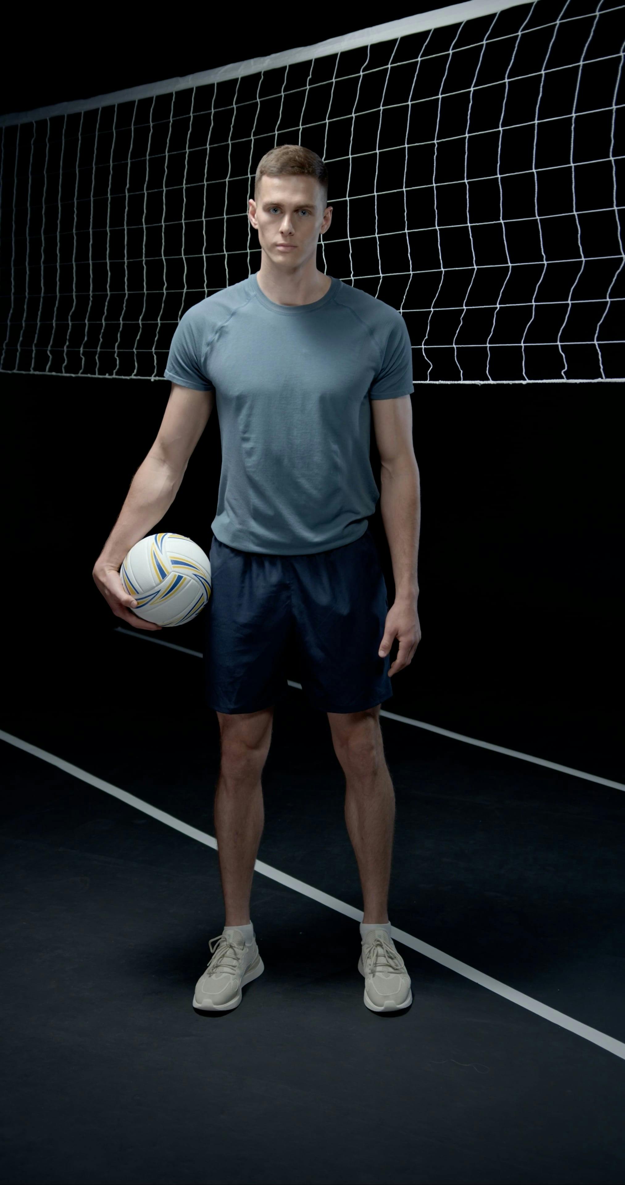 Volleyball Sportsman Standing at Net and Bouncing Ball on Floor Free ...