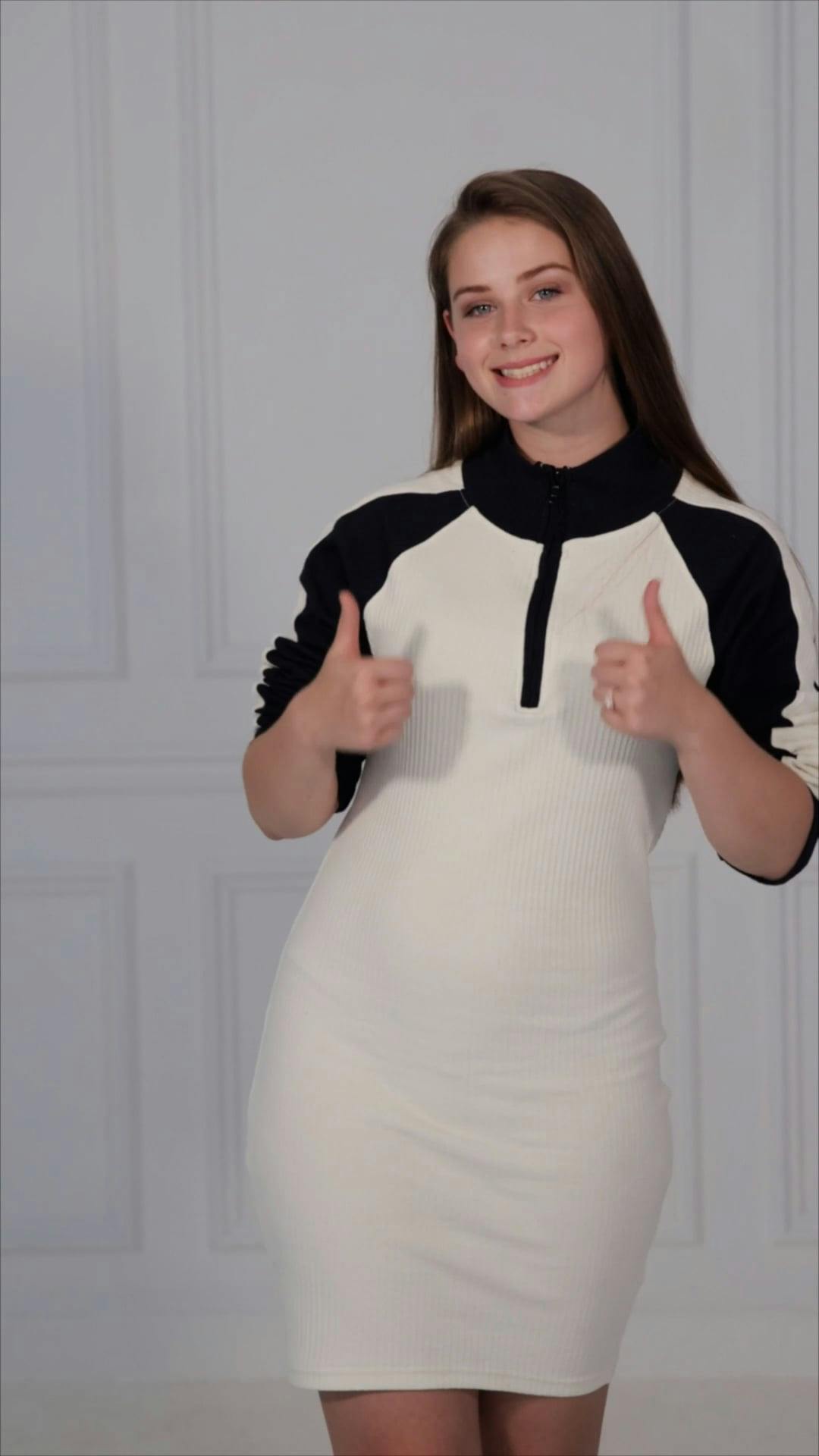 Beautiful Woman Wearing Dress Doing Sign Language While Looking at the ...