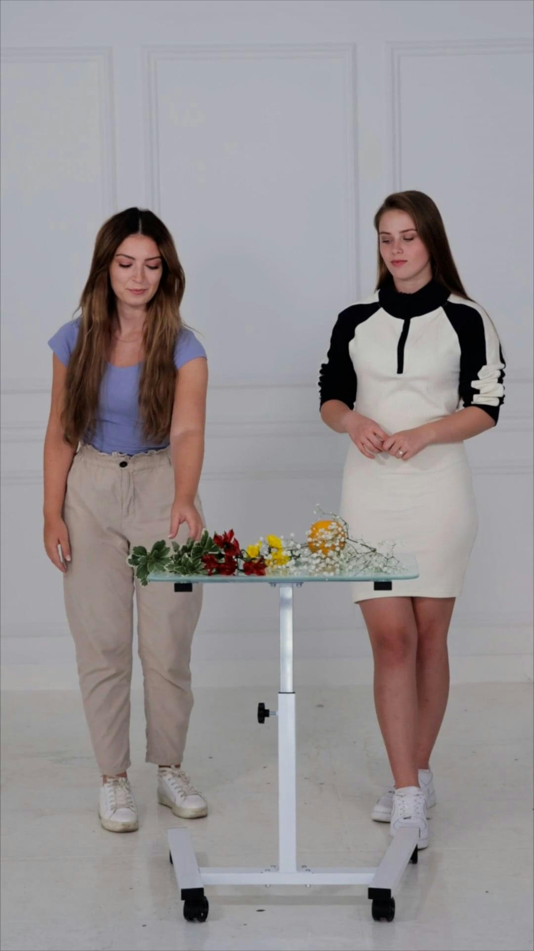 Woman Using Sign Language and Picking Up a Cloth on the Table Free ...