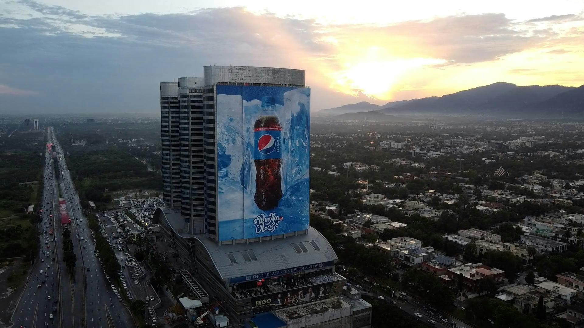 Drone Footage of a Pepsi Billboard on the Side of a Building Free Stock ...