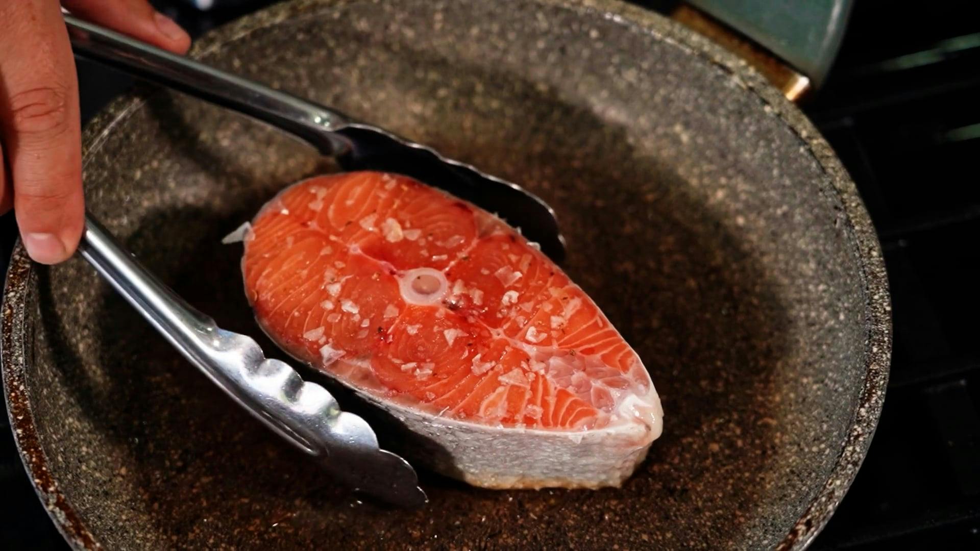 A Person Cooking a Fish on a Frying Pan Free Stock Video Footage ...