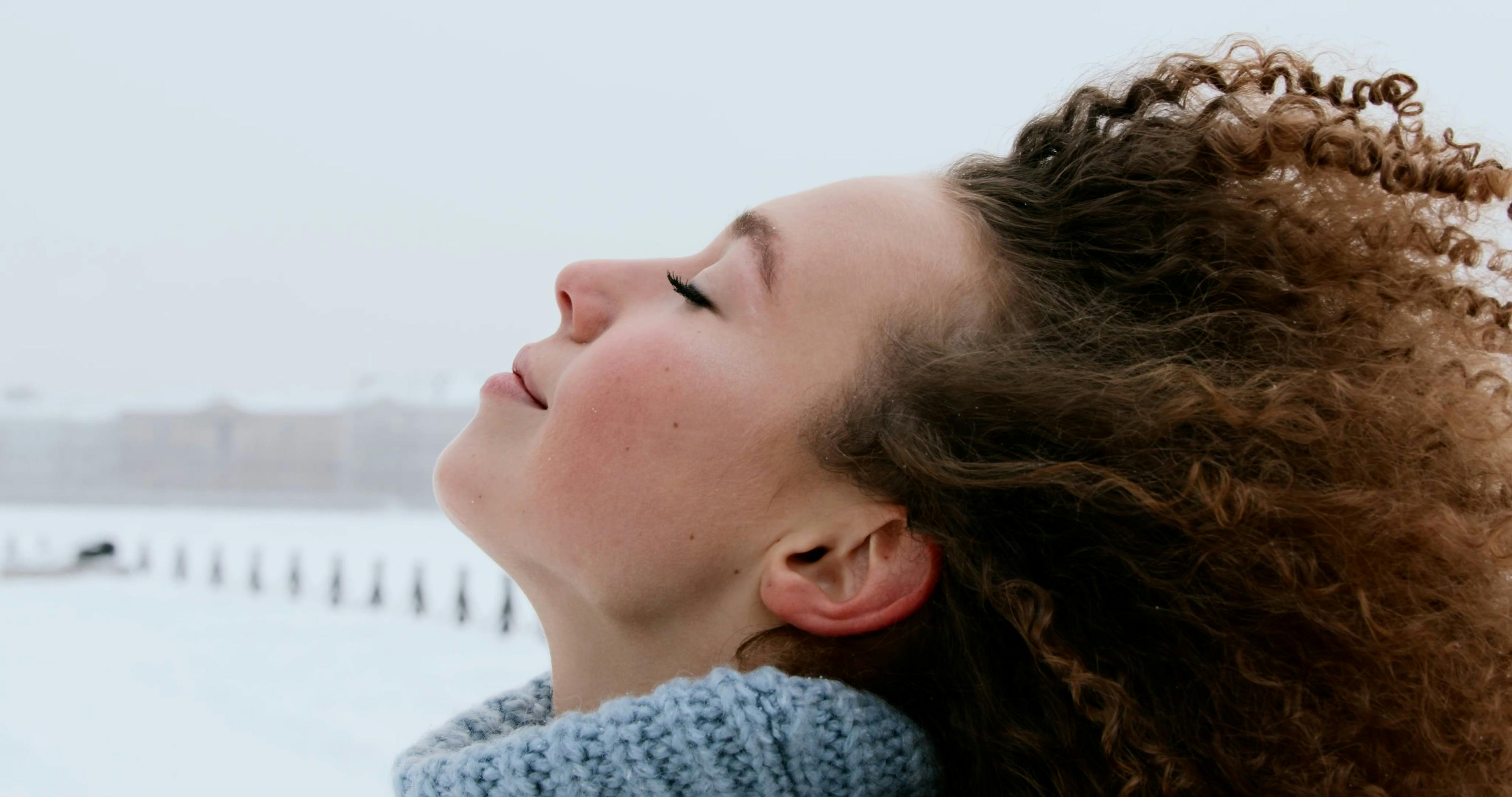 Close-up of a Smiling Woman on a Windy Winter's Day Free Stock Video ...