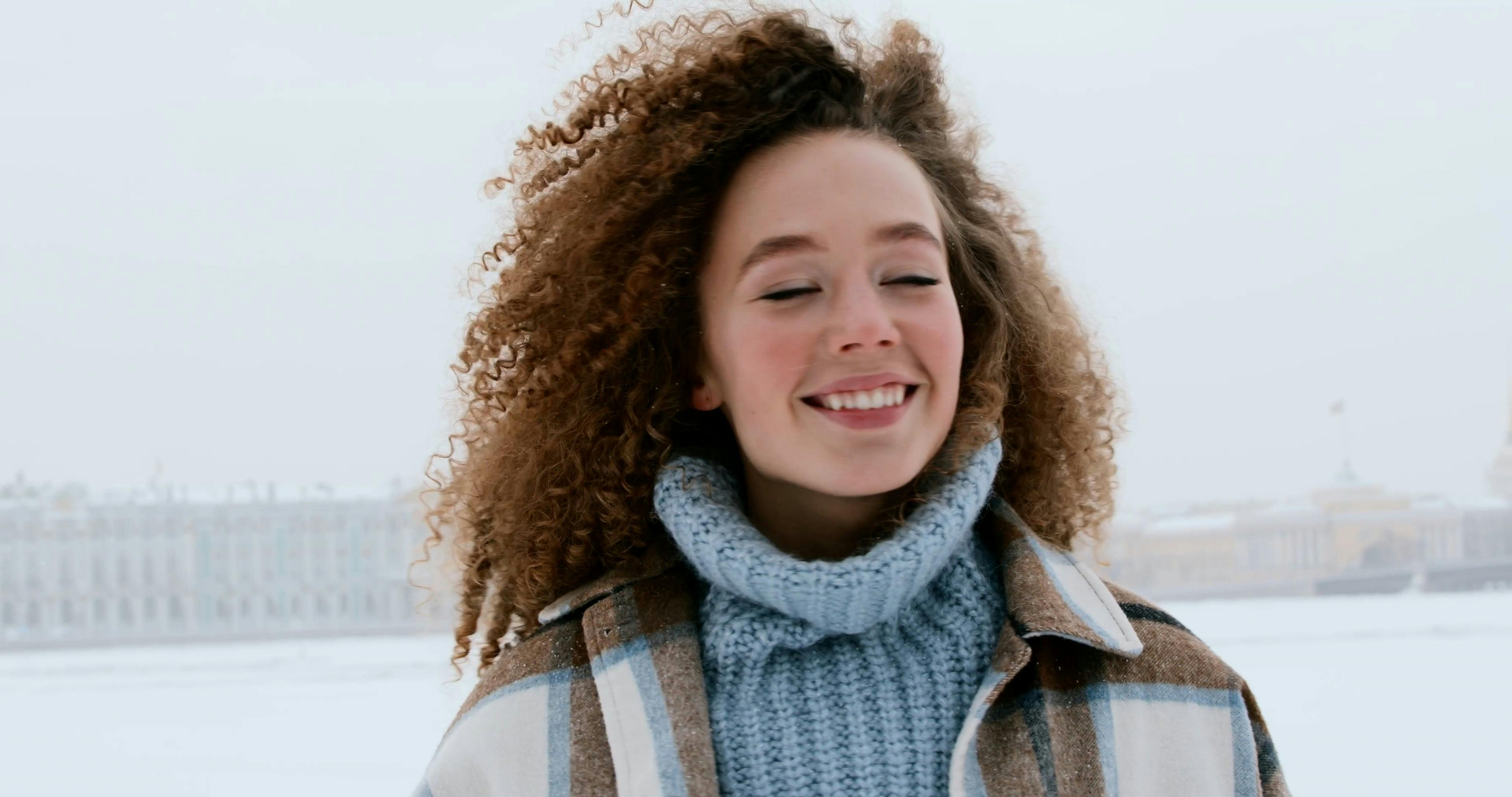 A Smiling Woman Swaying outside in the Snow Free Stock Video Footage ...