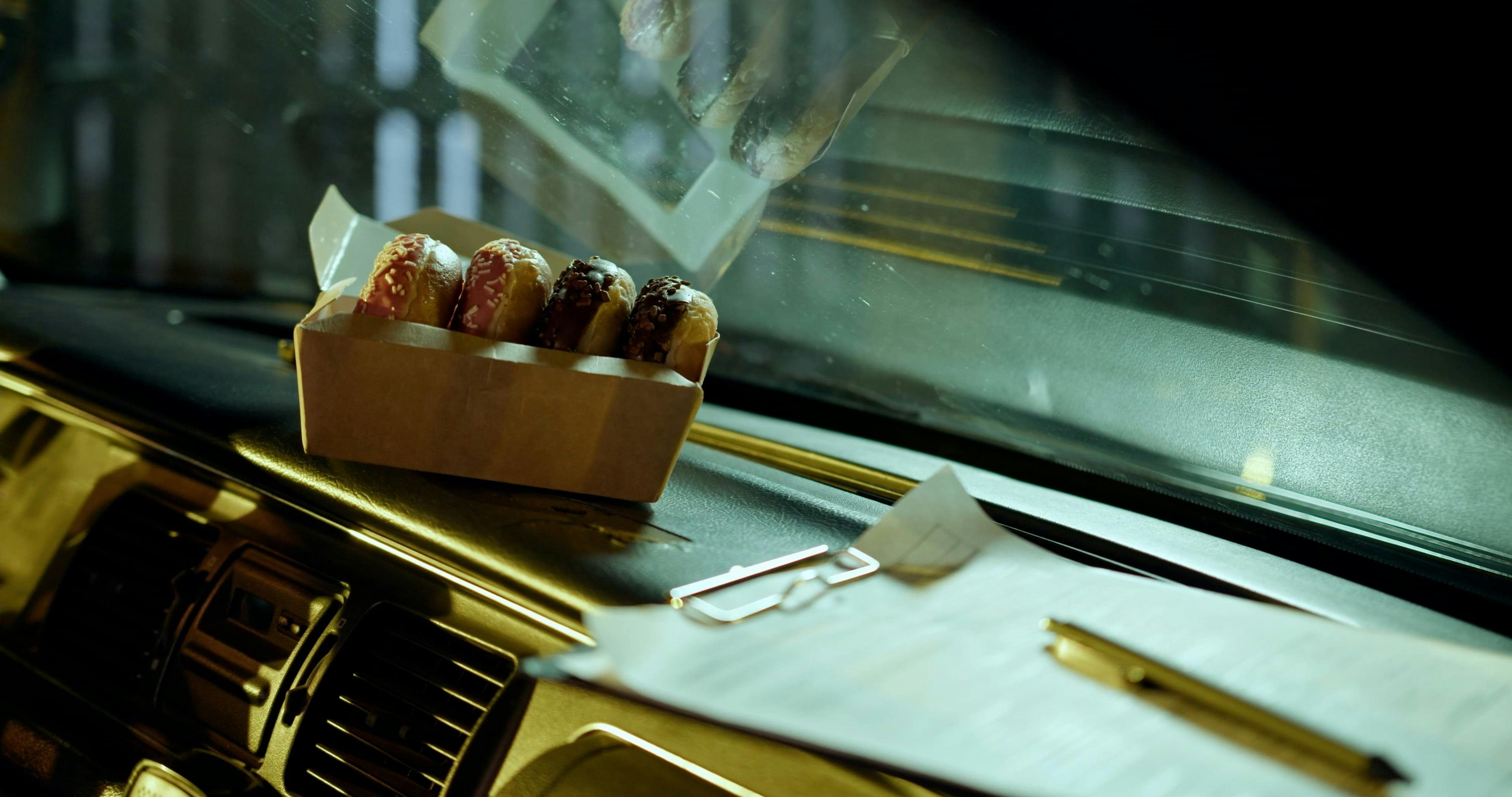 Hand Reaching for Doughnuts Inside Car Free Stock Video Footage ...