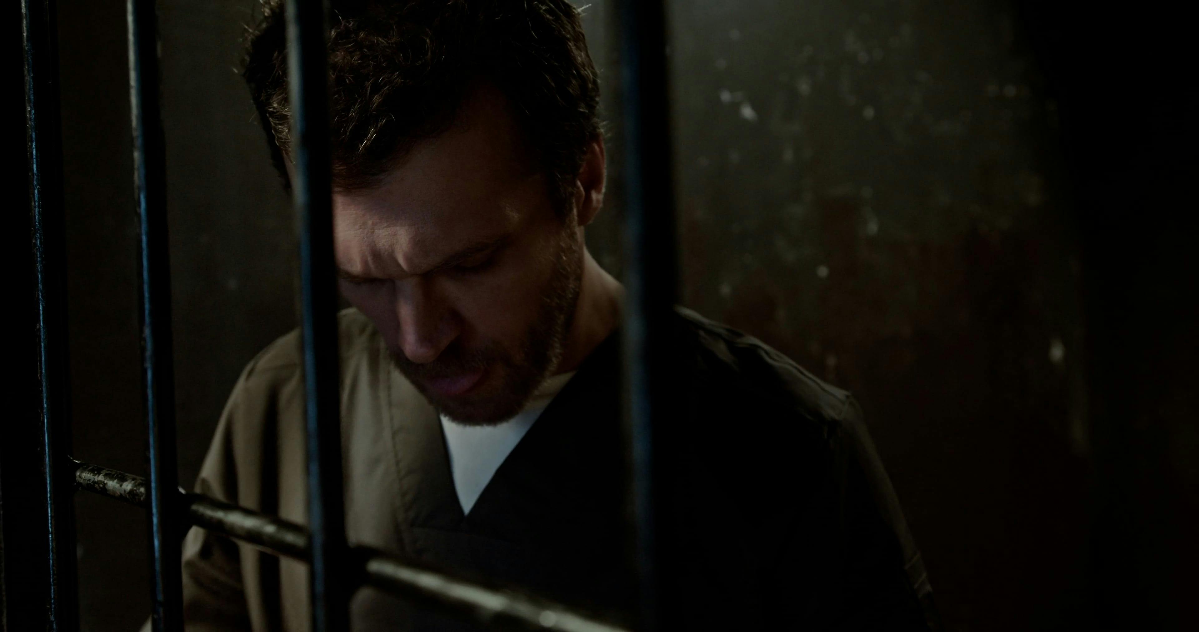 An Inmate Eating while Looking Outside the Cell Free Stock Video ...