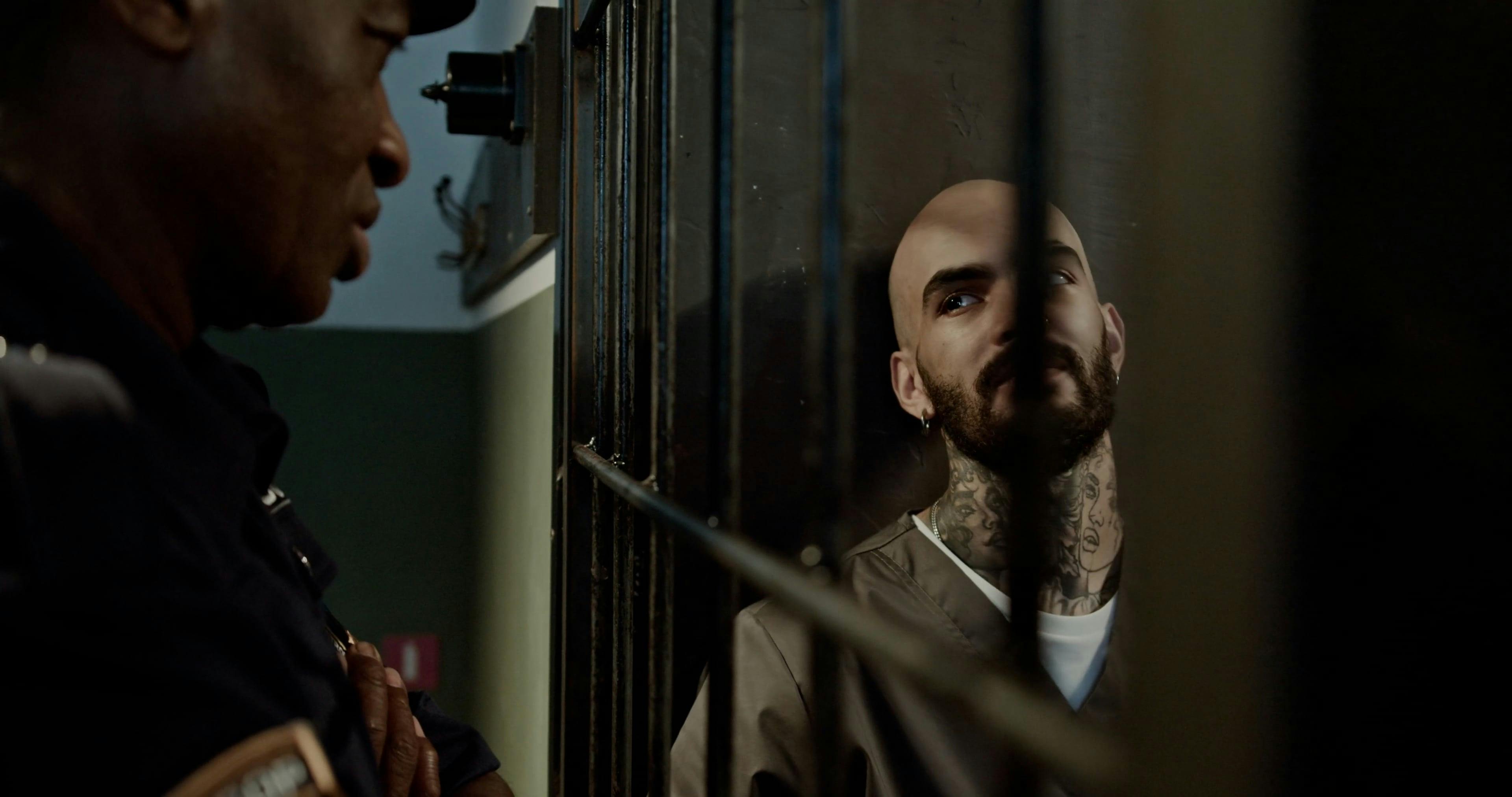 A Cop Man Laughing while Talking with Men Inside the Jail Free Stock ...