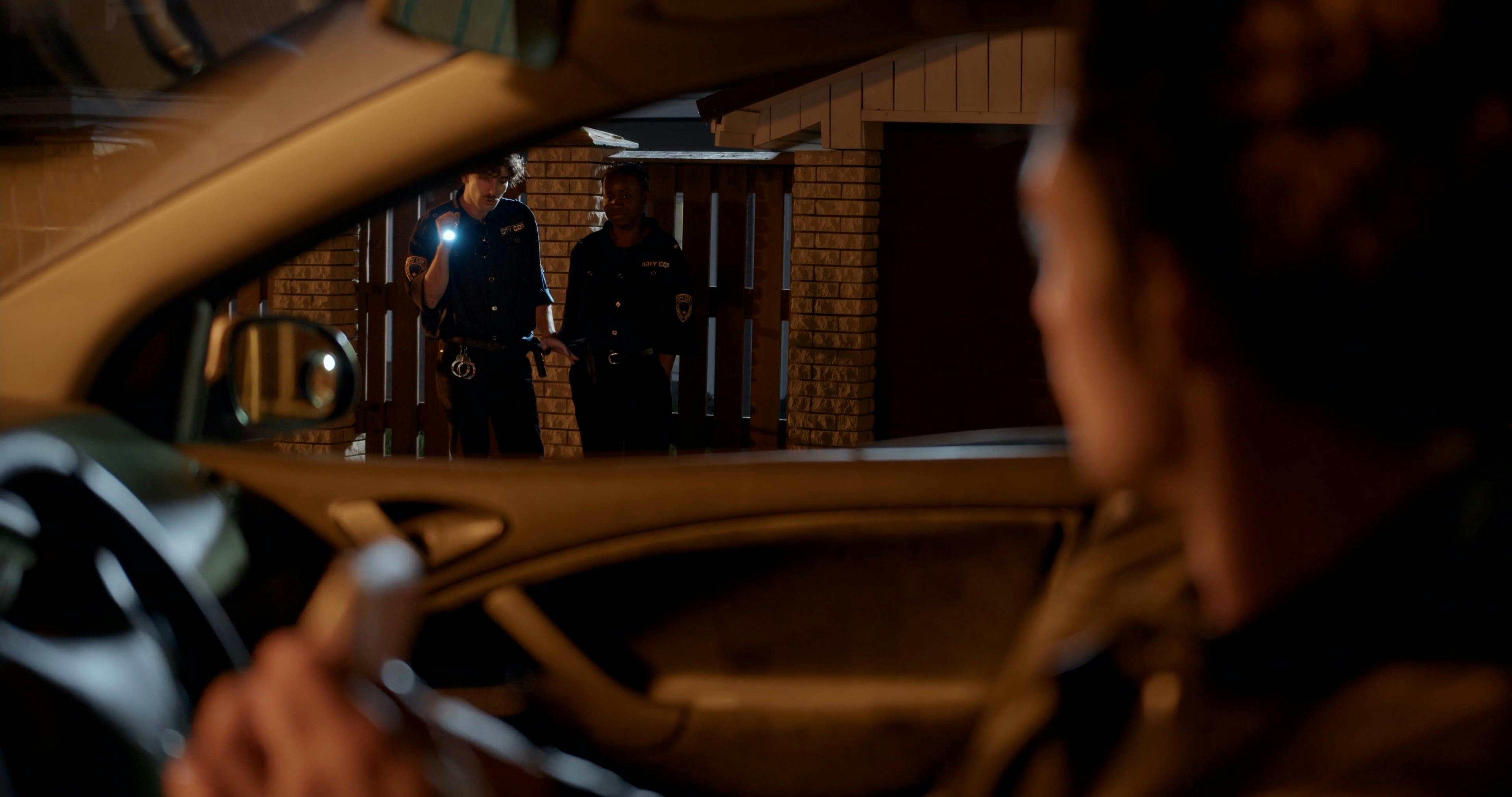 Police Officer Talking with Stringer at Crime Scene · Free Stock Video