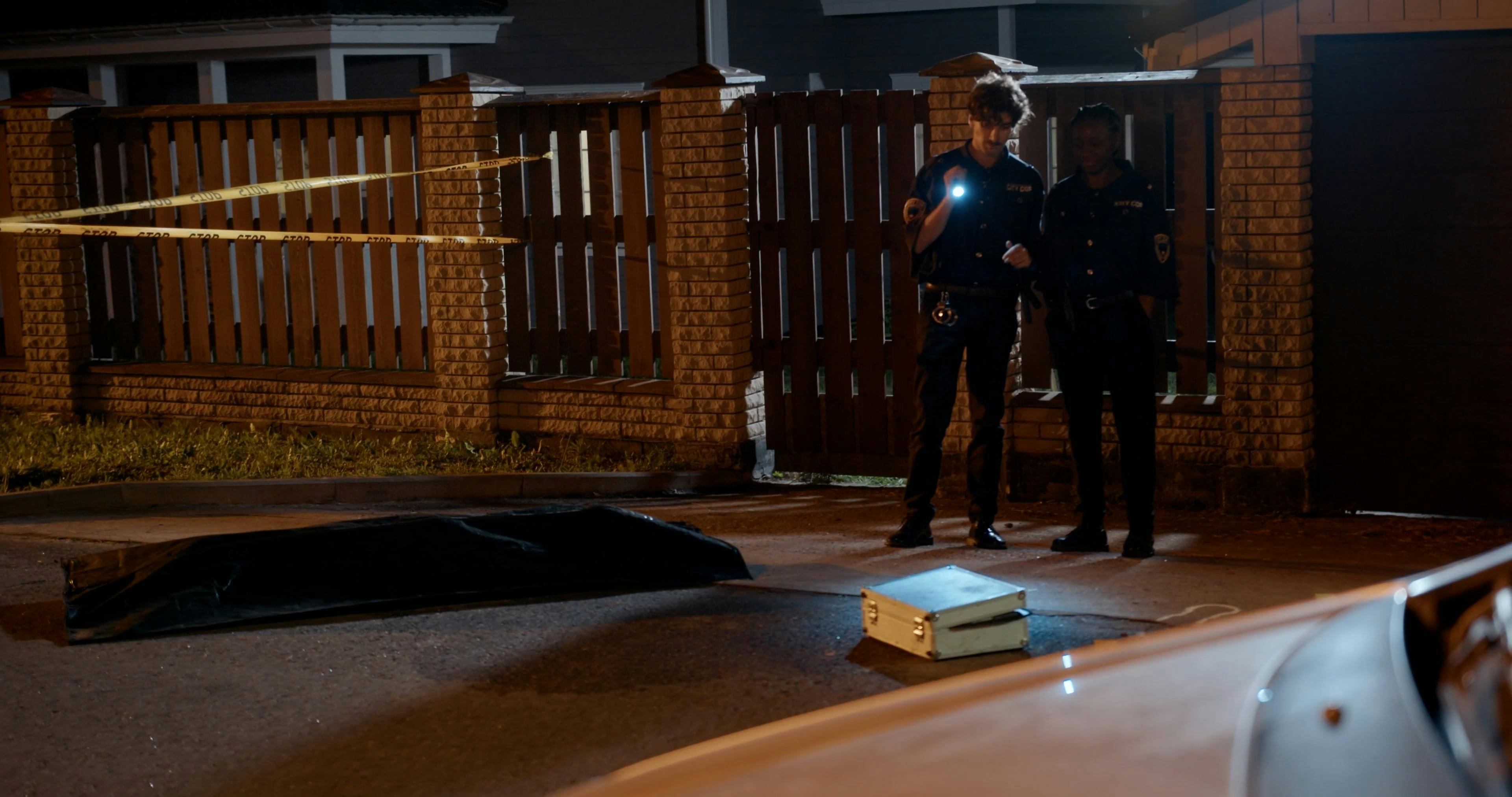 Two Police Officers Looking at a Crime Scene at Night · Free Stock Video