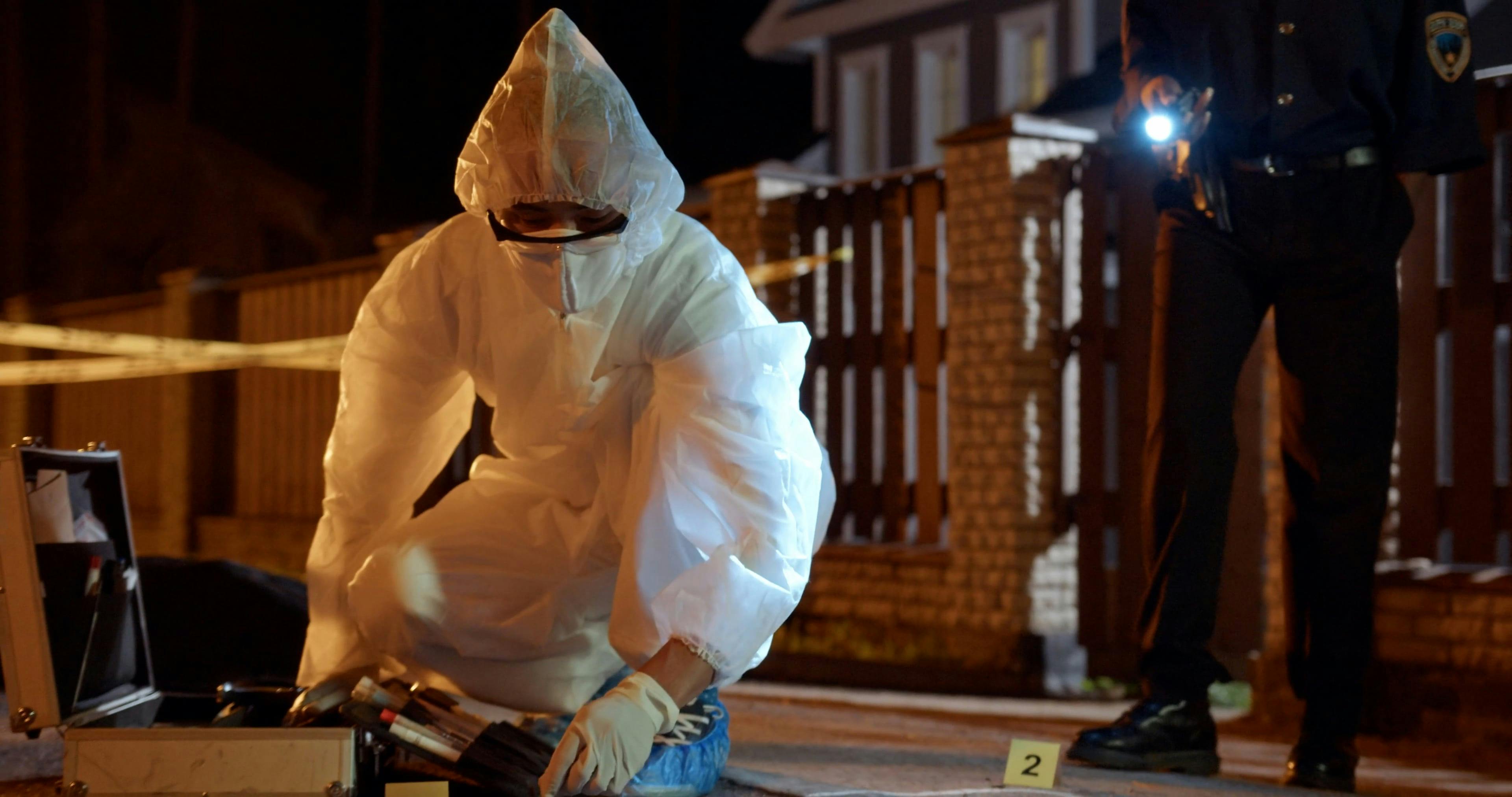 Police Officer and Technician inspecting Evidence at Night · Free Stock ...