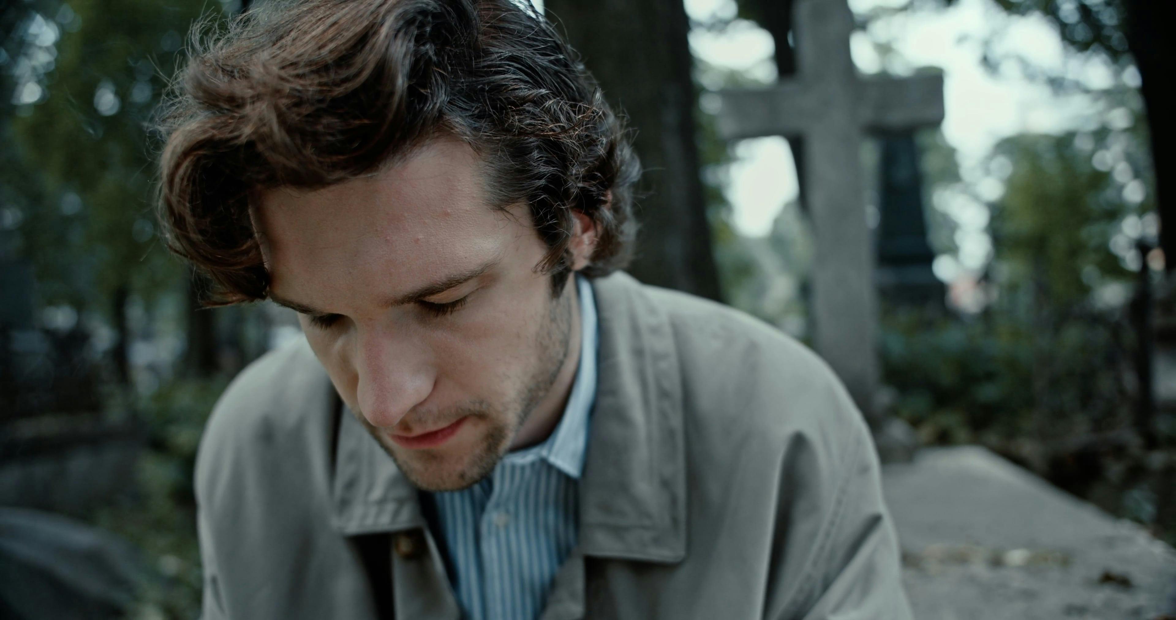 Man Smoking at Graveyard · Free Stock Video