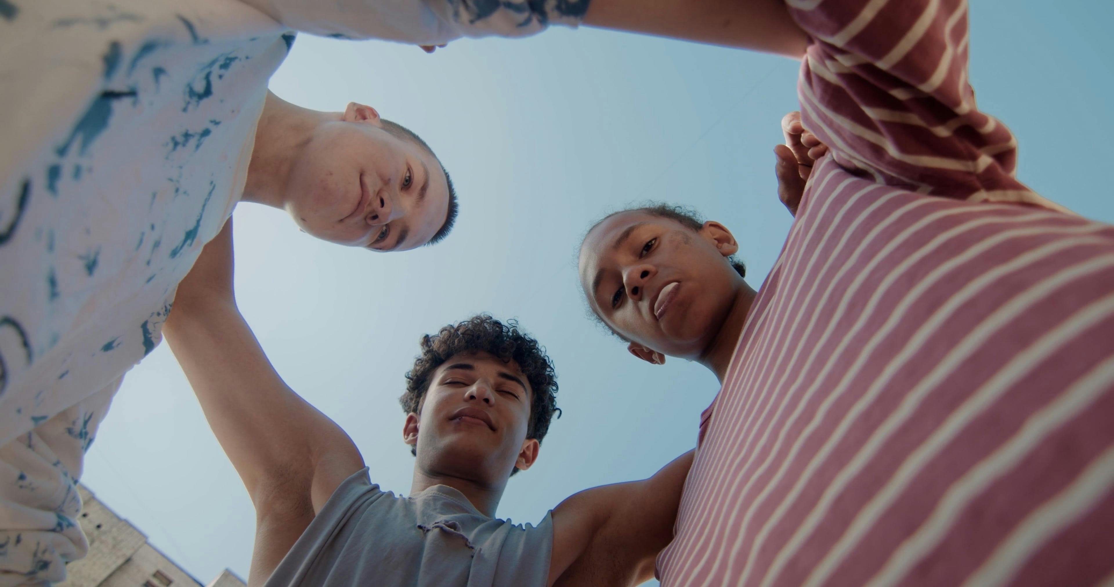 Low Angle Shot of Three Friends Hugging in Circle Free Stock Video ...