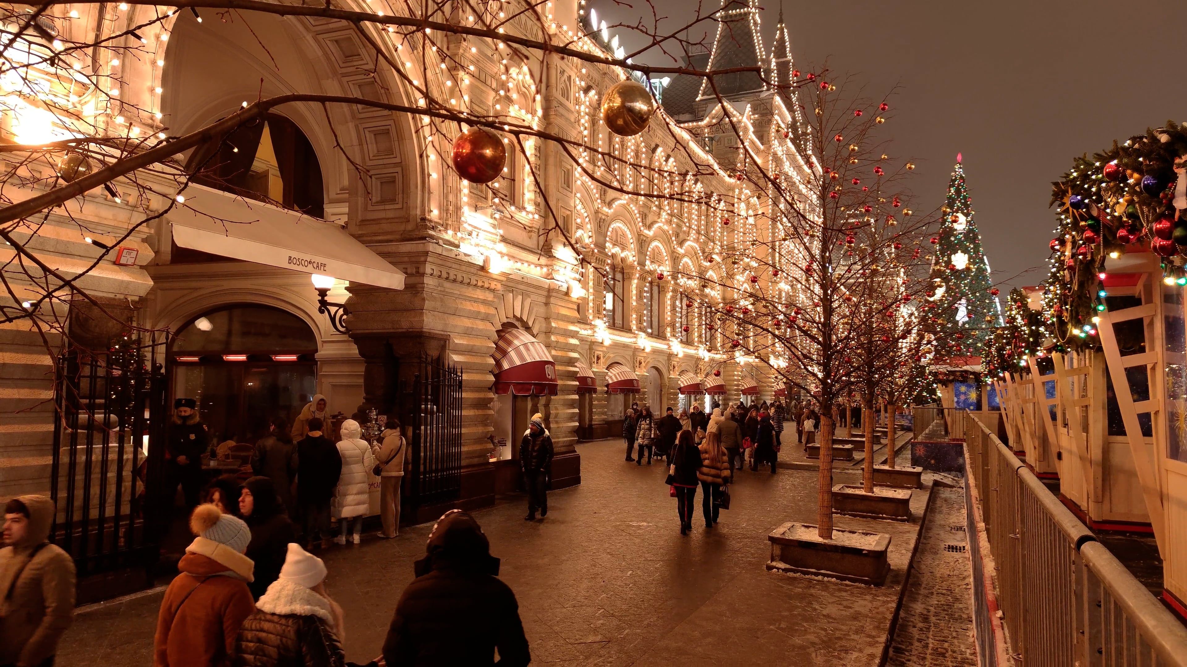 People Walking on Sidewalk around Christmas Decorations Free Stock ...