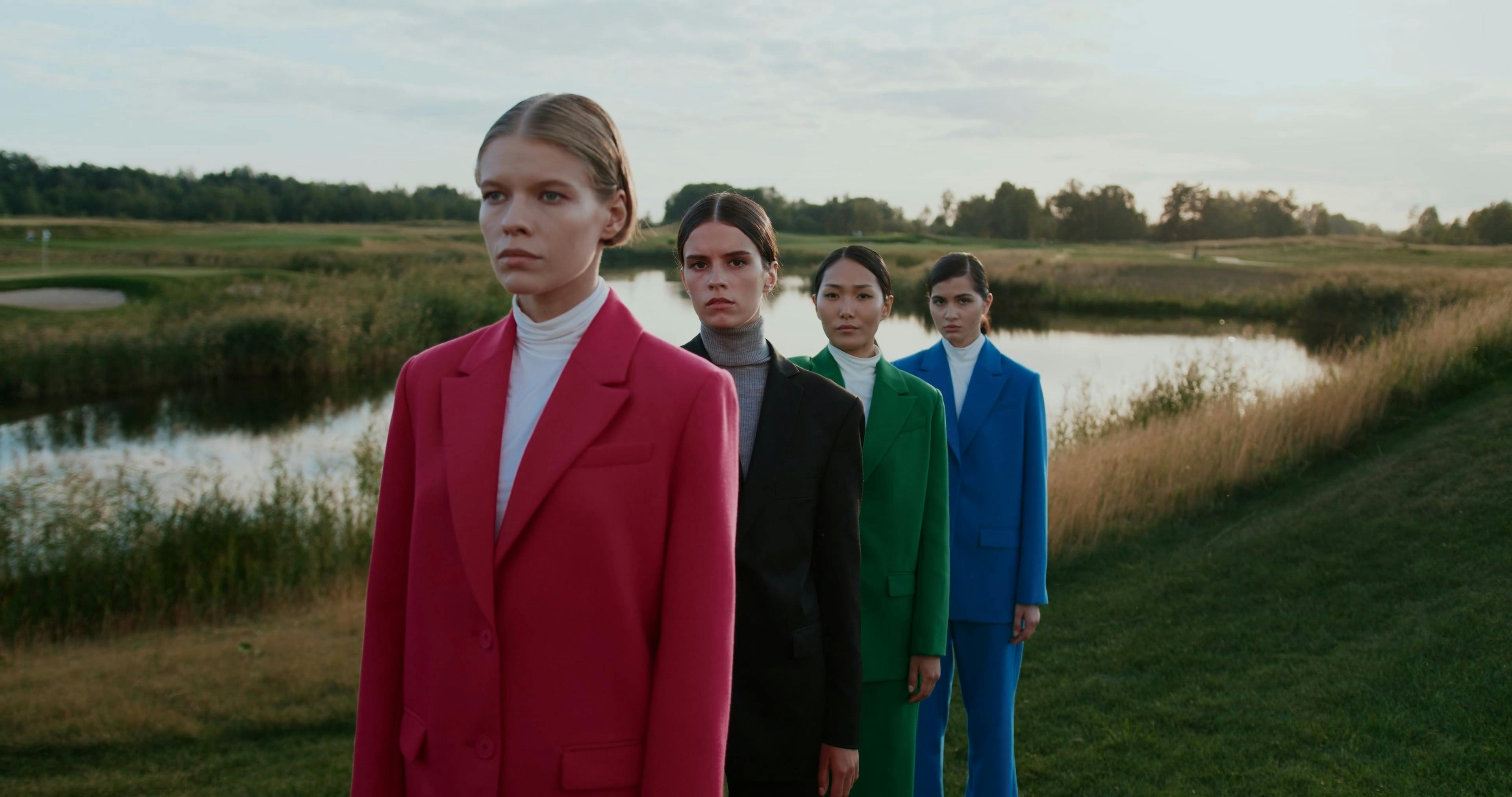 Women Standing in Line on Grass and Raising Arms Free Stock Video ...