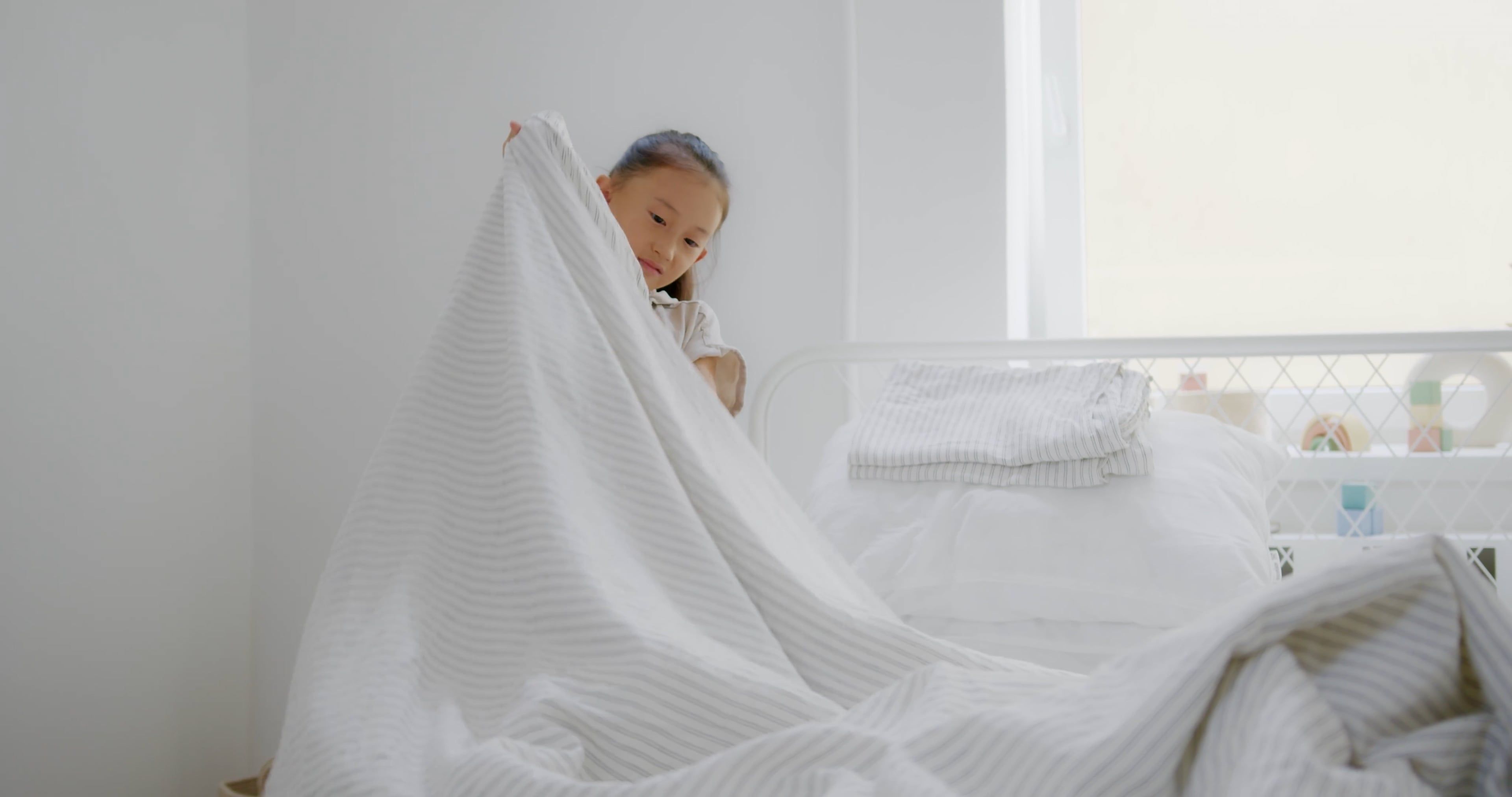 A Woman Helping her Daughter Fix a Bed Free Stock Video Footage ...