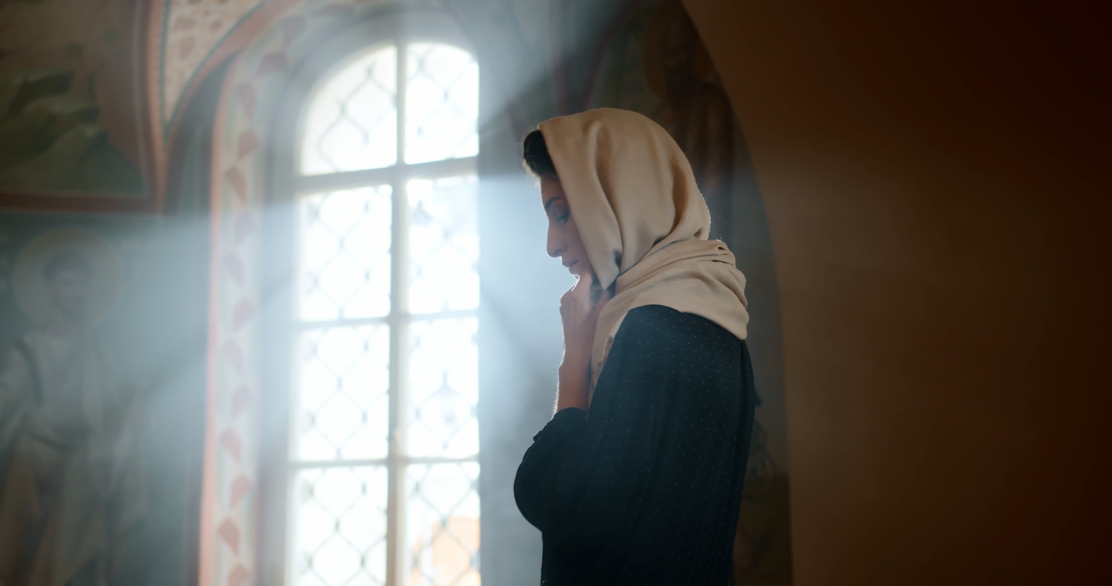 A Woman Kissing a Religious Icon in a Church Free Stock Video Footage ...