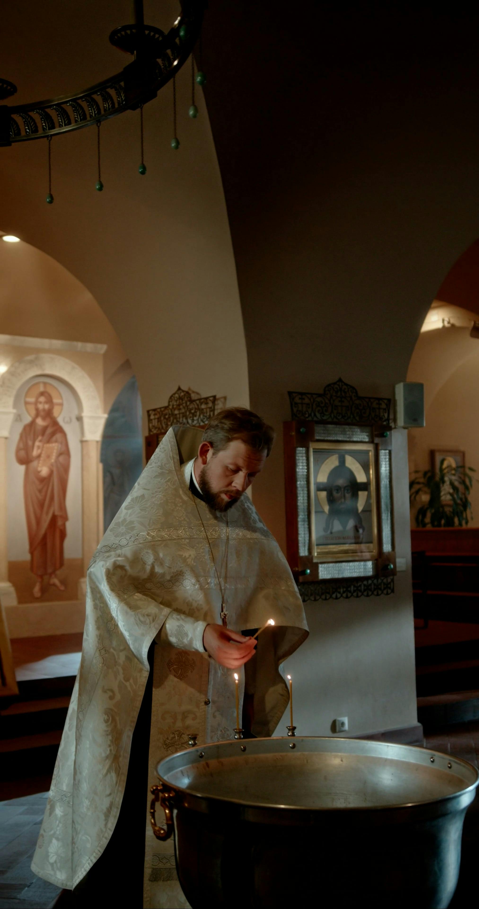 A Priest Lighting Candles and Speaking during a Ceremony Free Stock ...