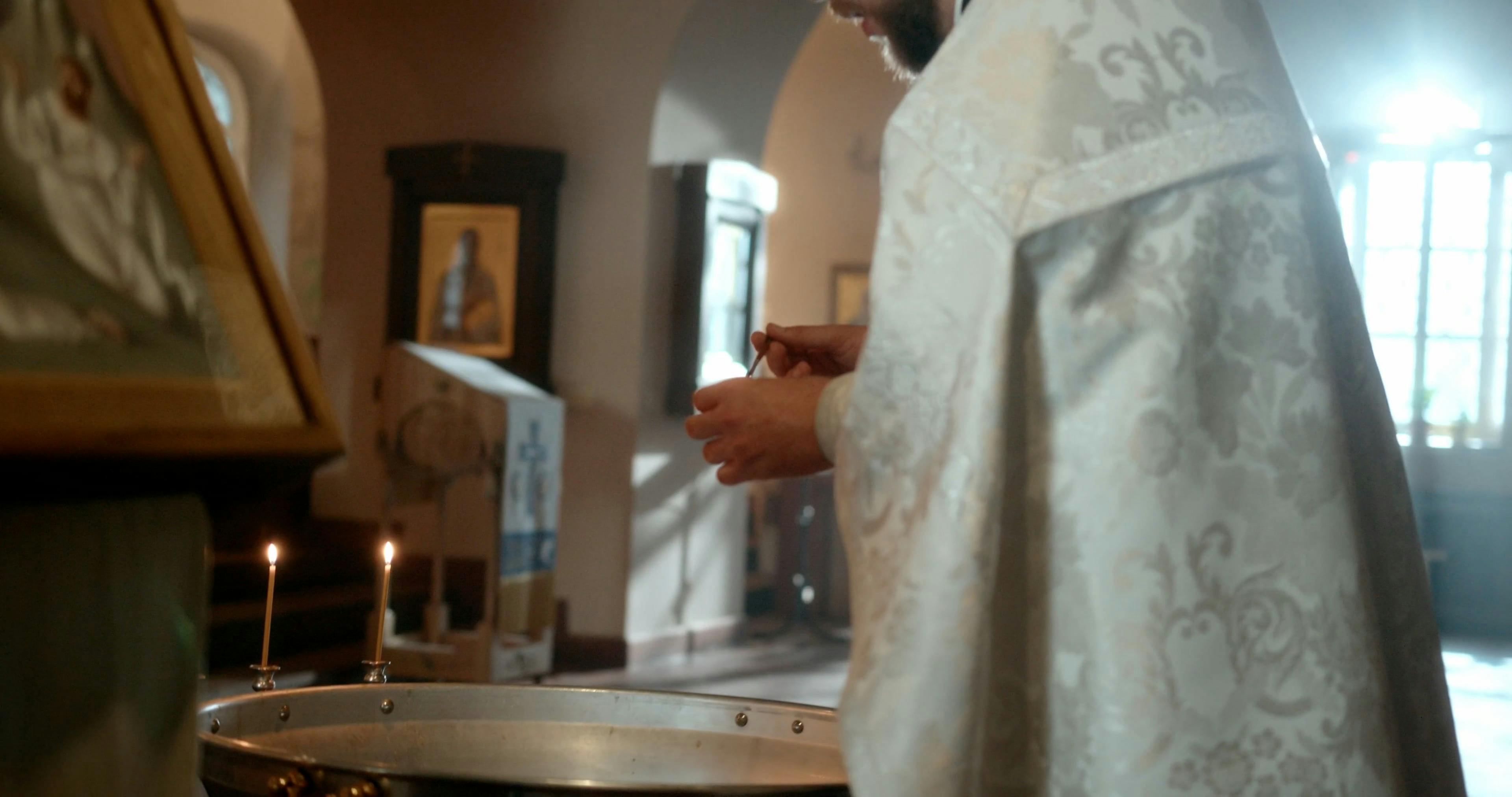 A Priest Preparing Holy Water for a Baptism Ceremony Free Stock Video ...