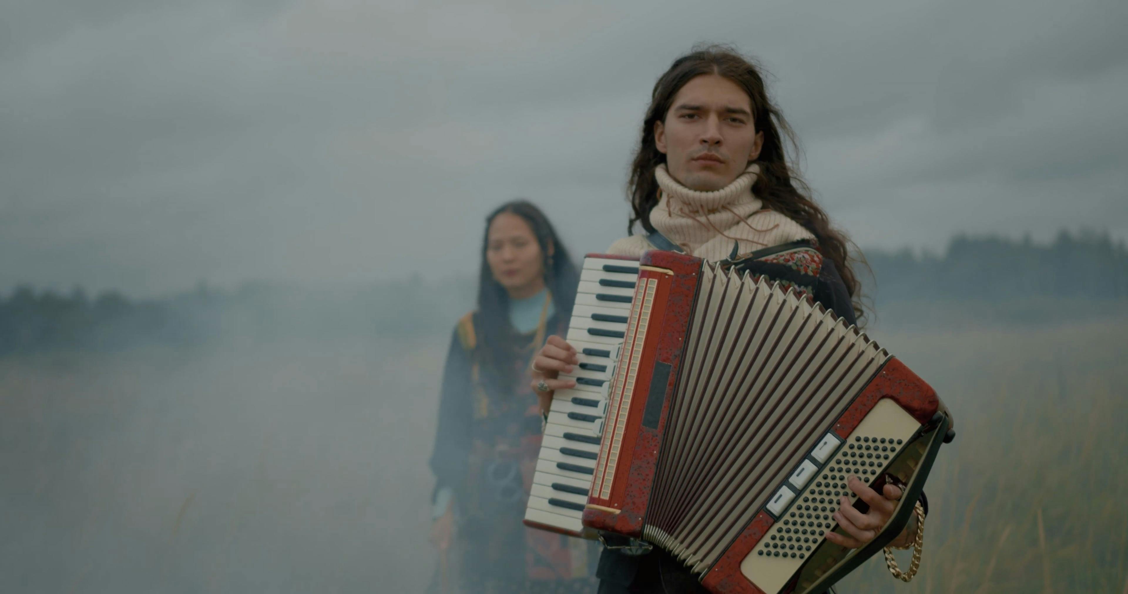 A Gypsy Couple with Musical Instruments Standing in a Field Free Stock ...