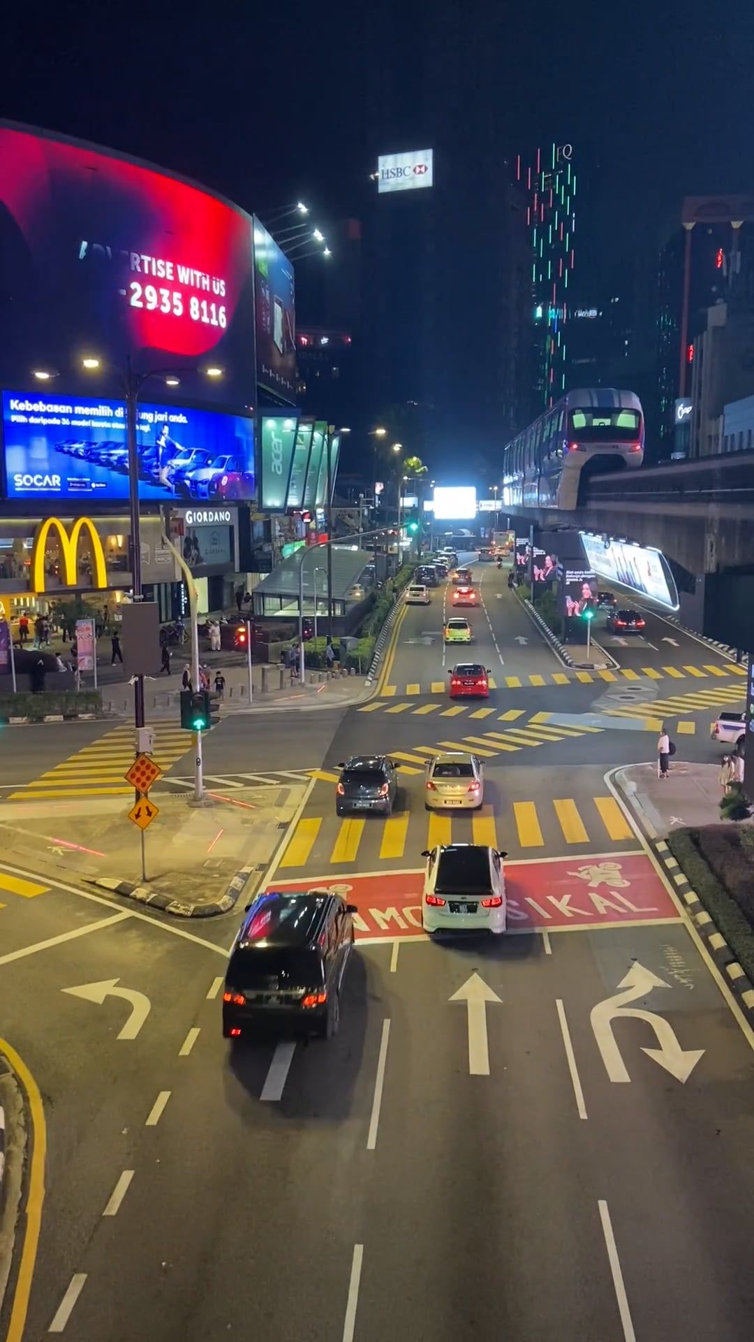 Motor Vehicles Traffic On A Busy Road Intersection In Kuala Lumpur ...