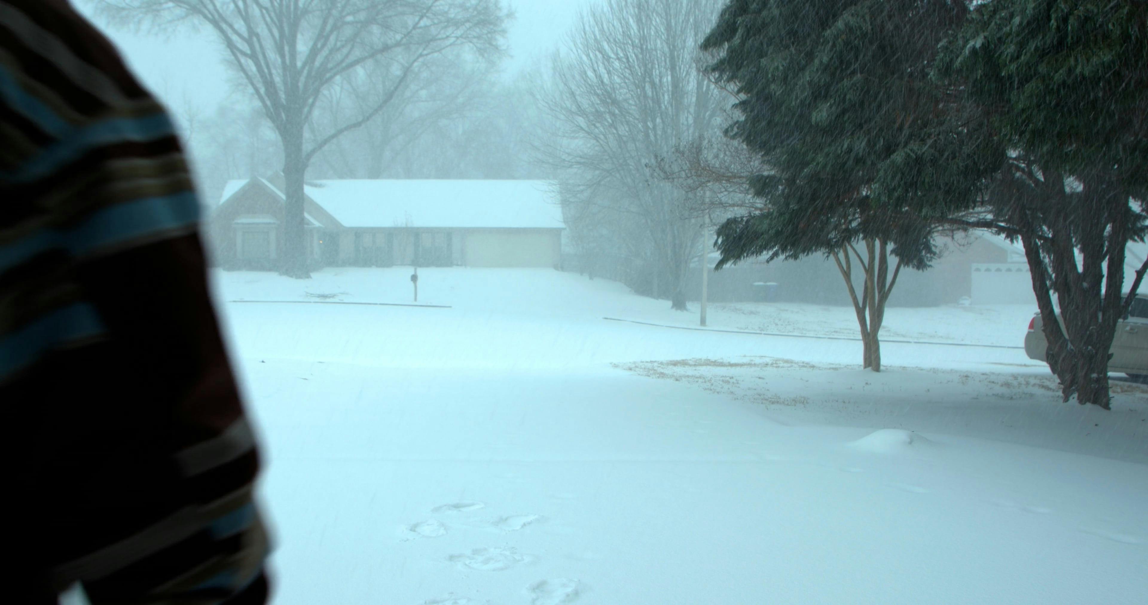 A Man Walking in Heavy Snowfall · Free Stock Video