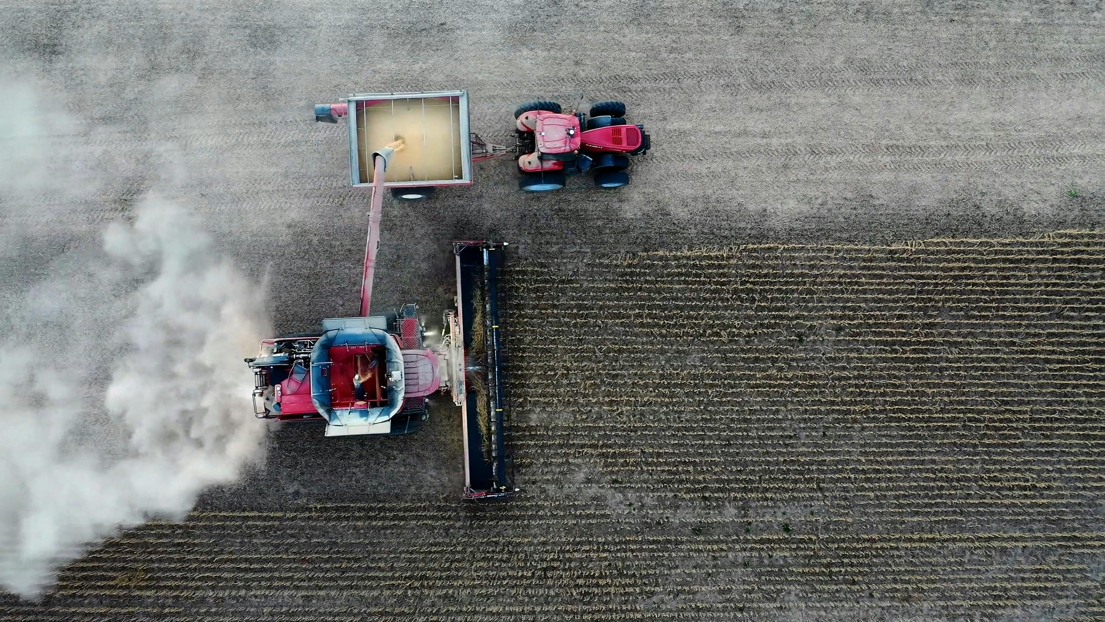 Drone Footage of a Farmer using a Tractor while Harvesting Crops Free ...