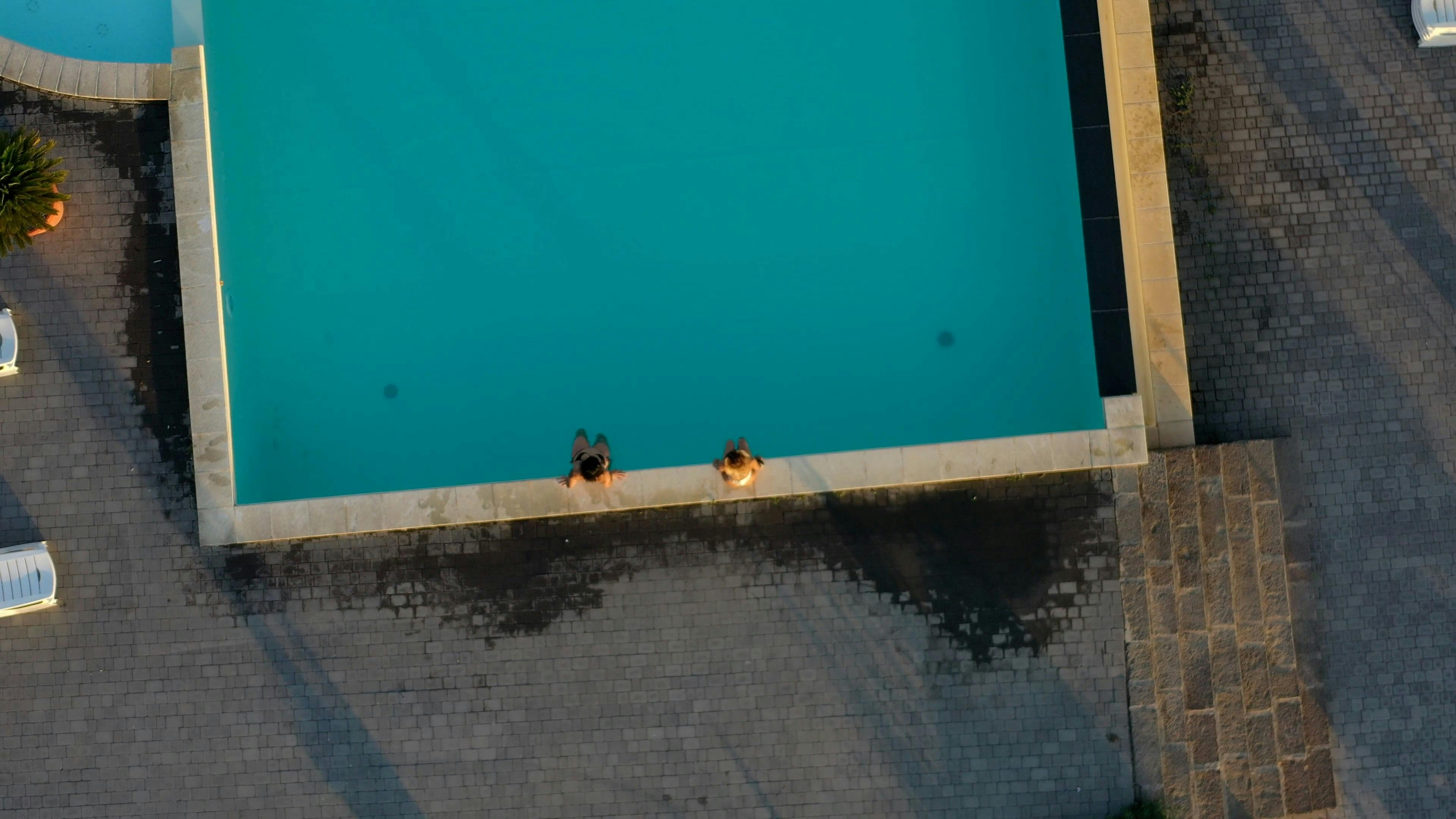 From Above Footage A Woman Wearing A Wide-brimmed Hat Sitting On A ...
